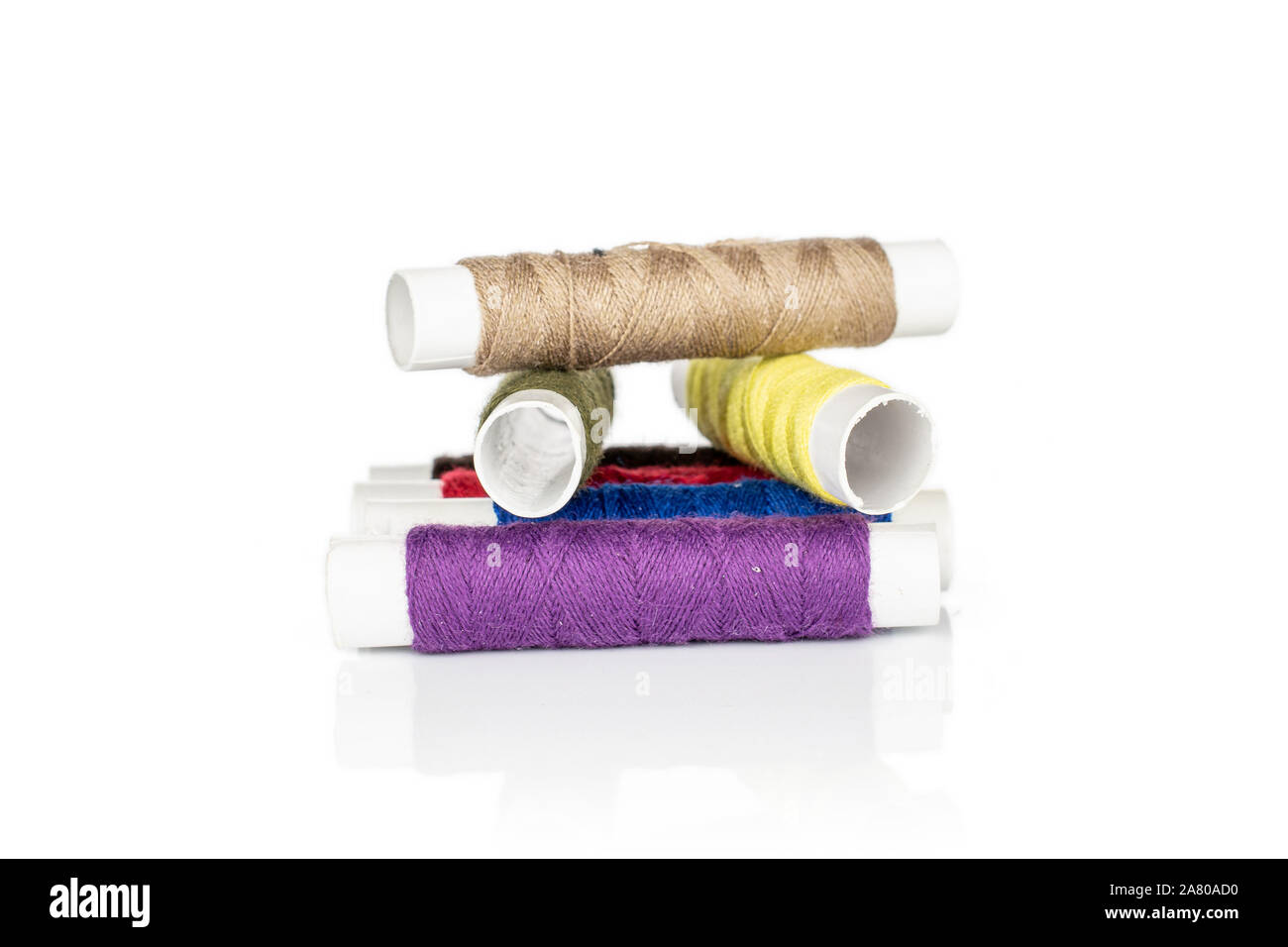 Group of seven whole sewing thread spool isolated on white background ...
