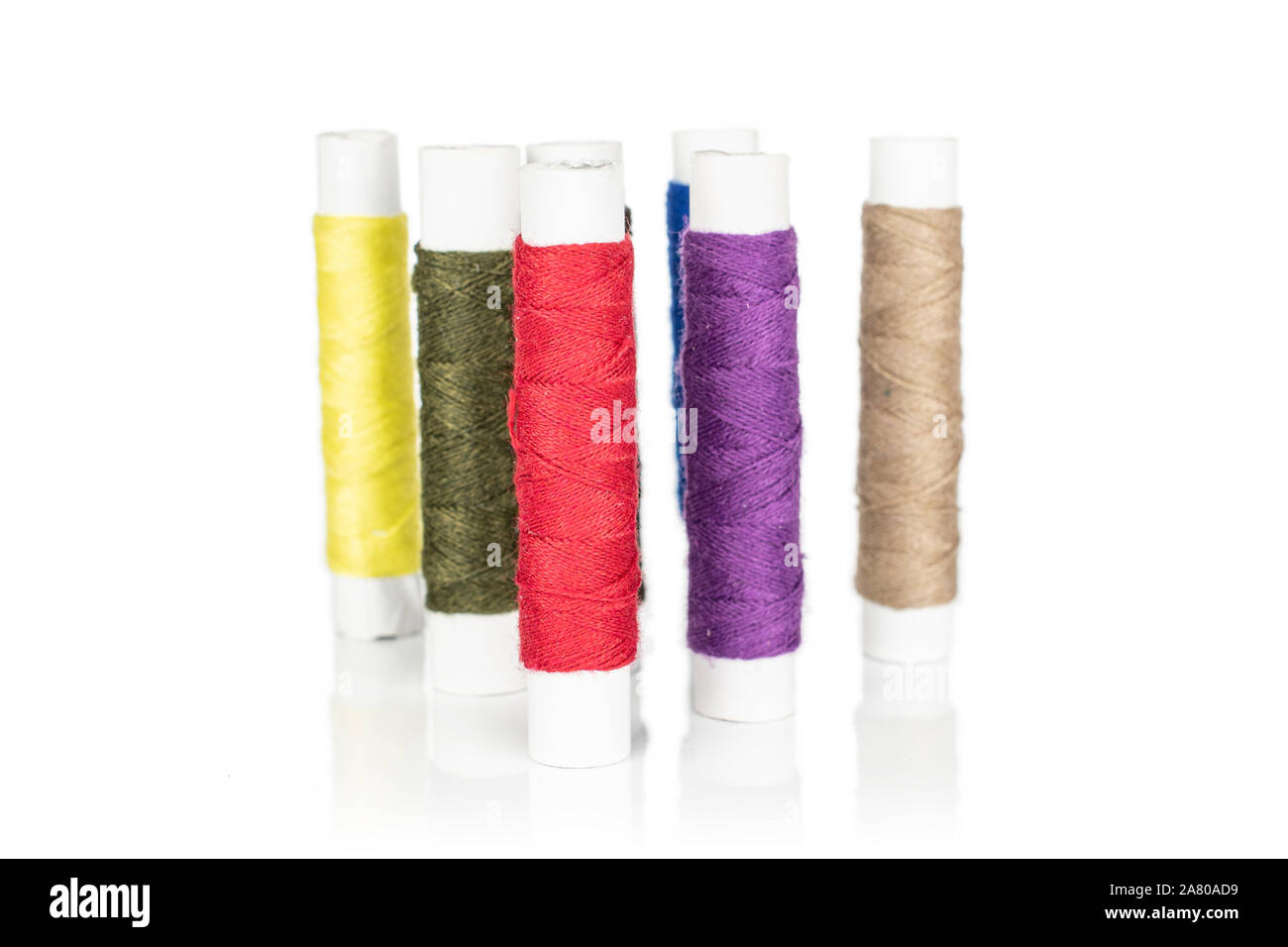 Group of six whole sewing thread spool isolated on white background ...