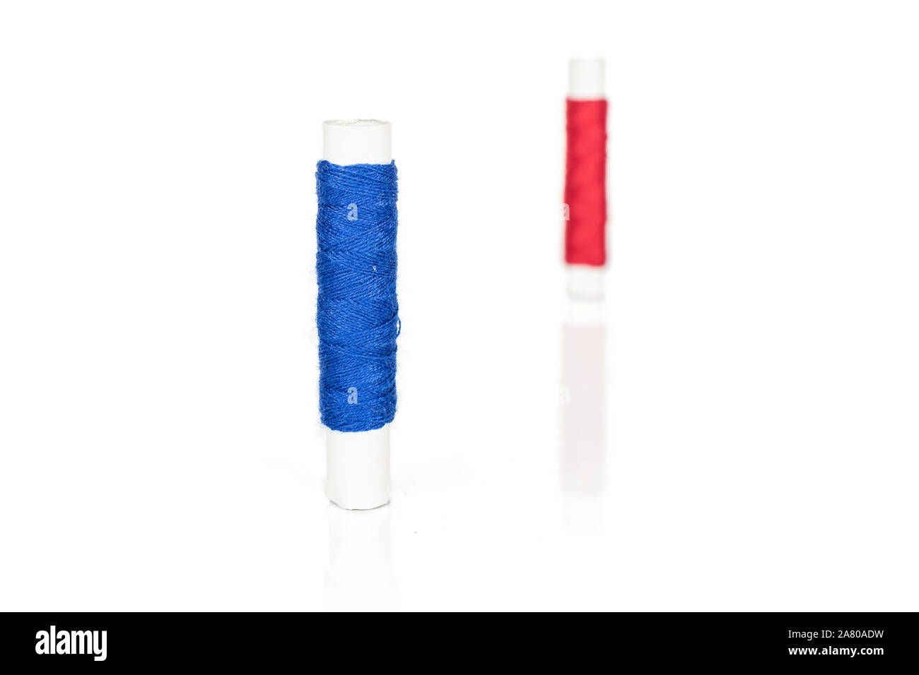 Group of two whole sewing thread spool isolated on white background ...