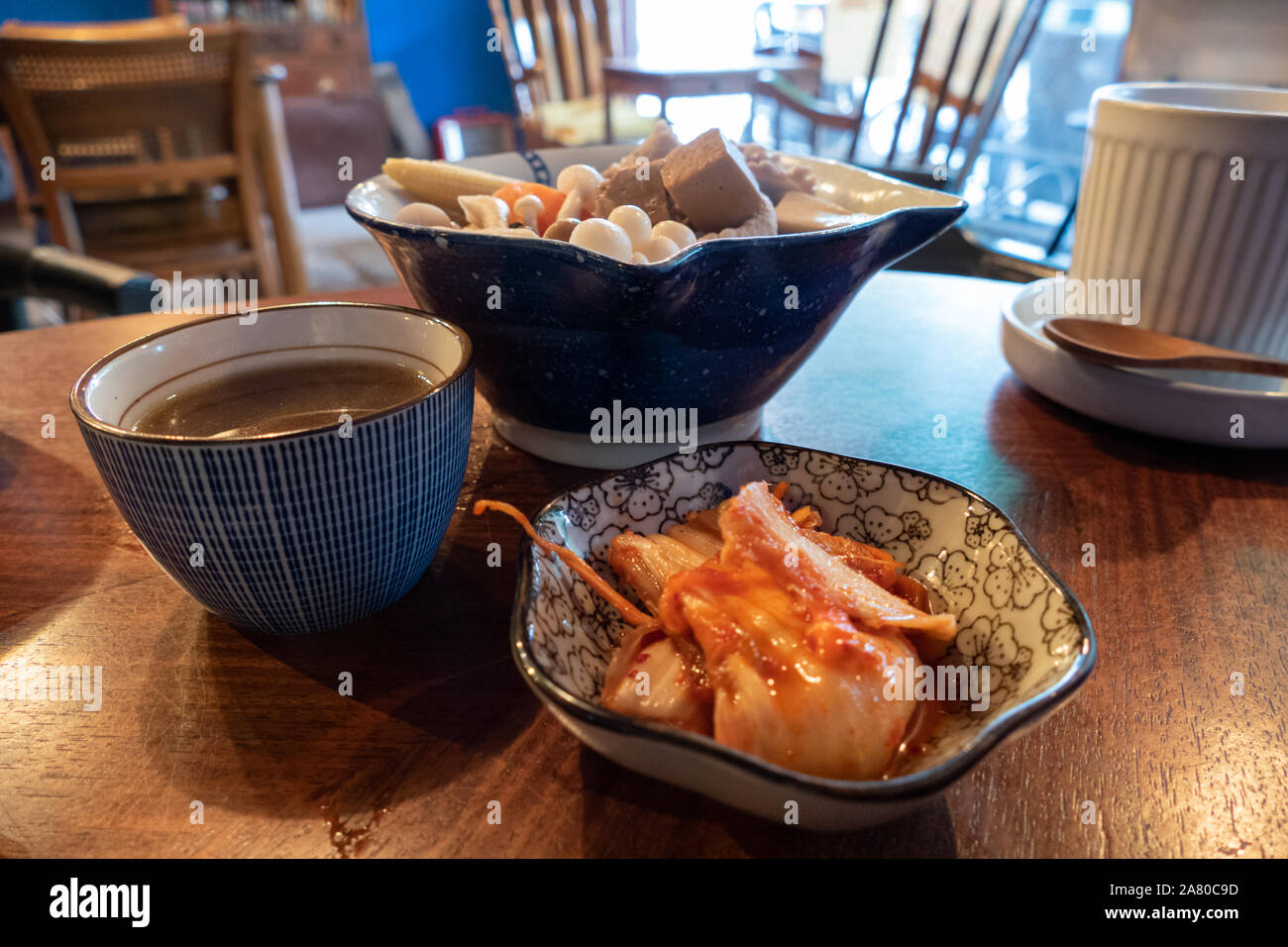 Asian kimchi with dishes in background, lunch spread Stock Photo - Alamy