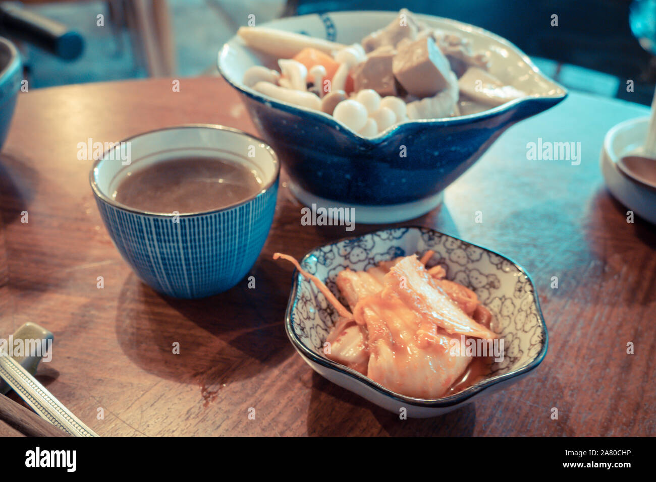 Asian kimchi with dishes in background, lunch spread Stock Photo - Alamy