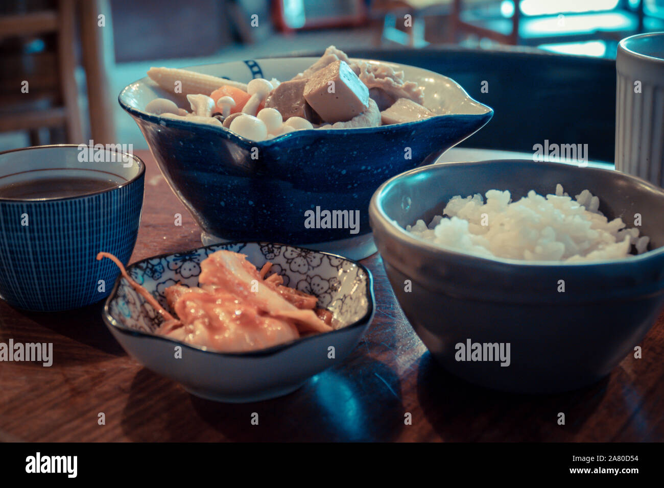 Asian kimchi with dishes in background, lunch spread Stock Photo - Alamy