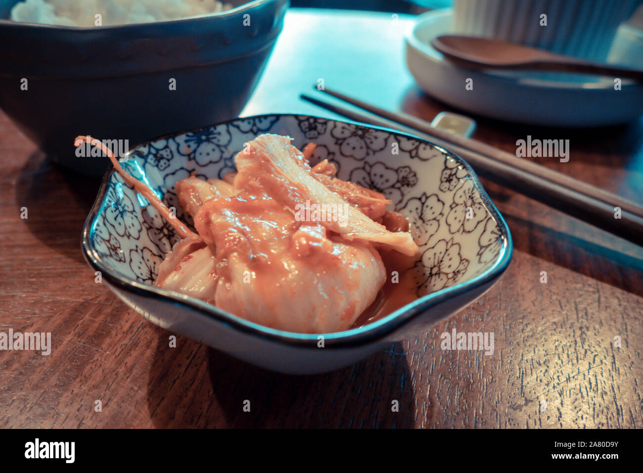 Asian kimchi with dishes in background, lunch spread Stock Photo - Alamy