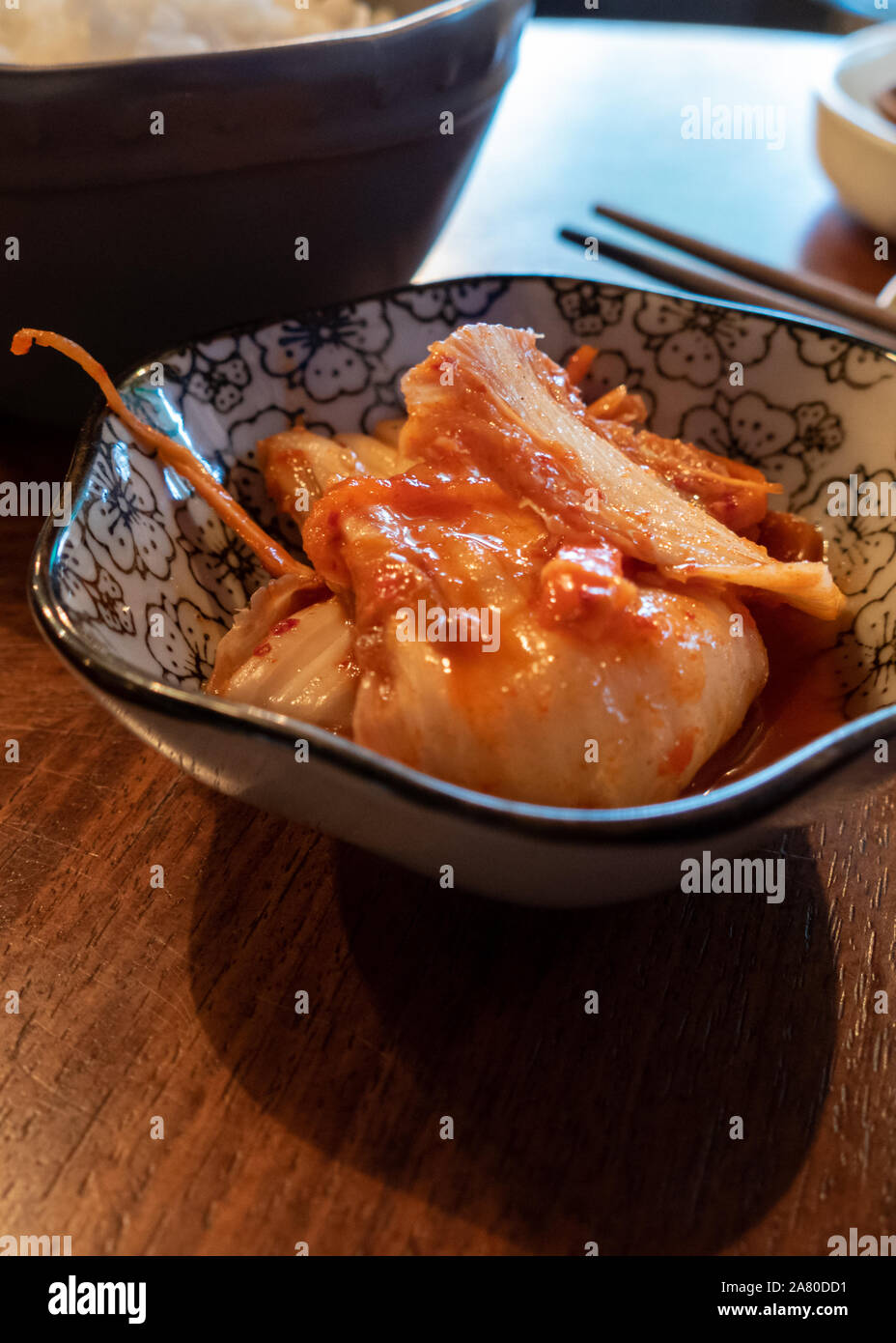 Asian kimchi with dishes in background, lunch spread Stock Photo - Alamy