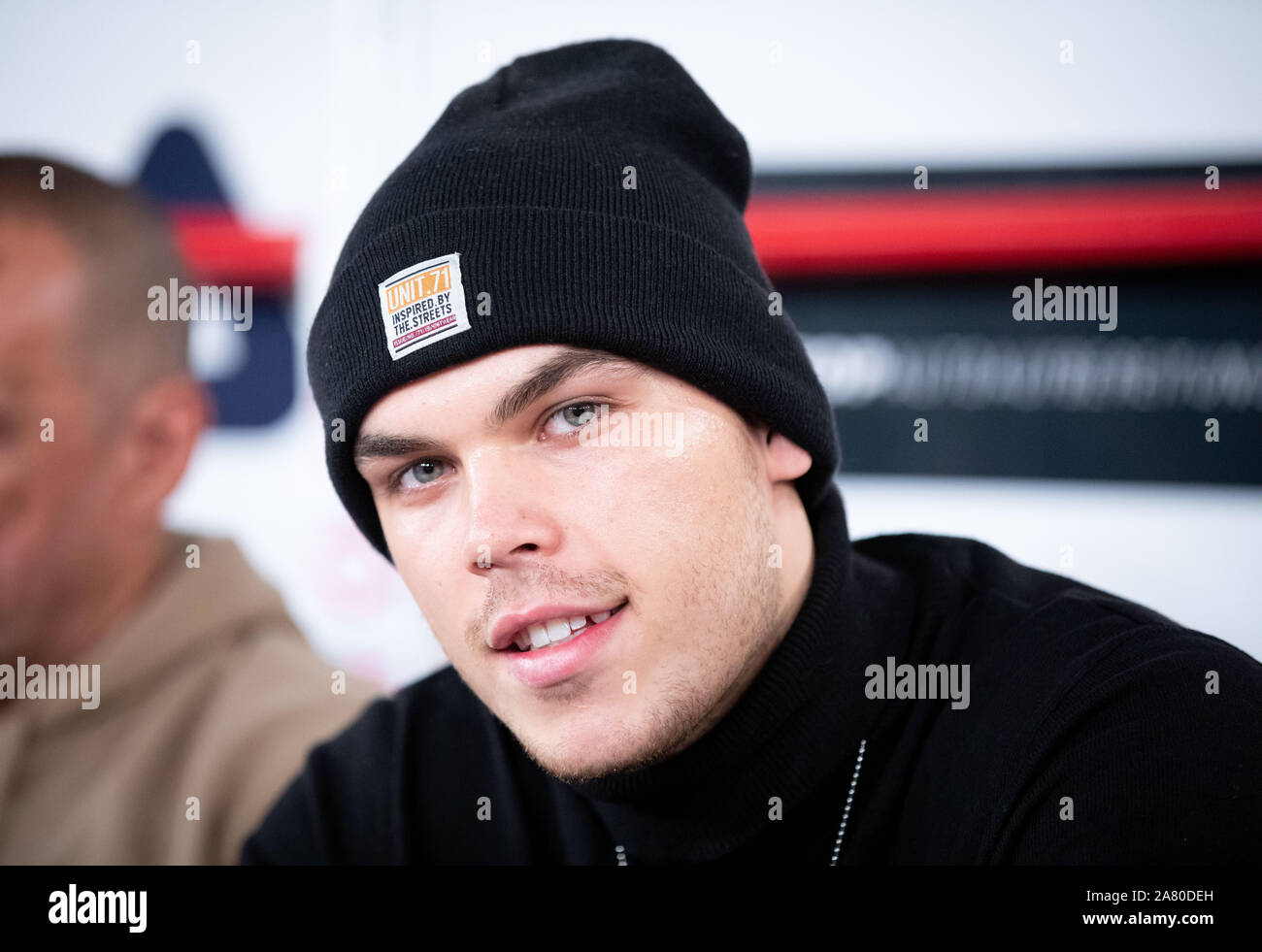 Hamburg, Germany. 05th Nov, 2019. Leon Bauer, boxer, sits on the podium ...