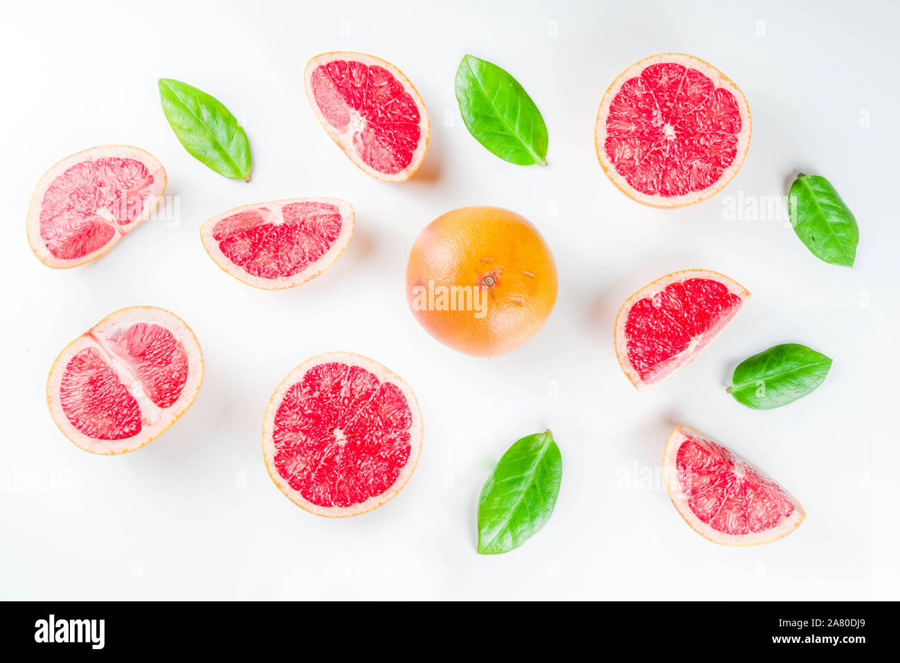 Whole and sliced grapefruit isolated on white background Stock Photo ...
