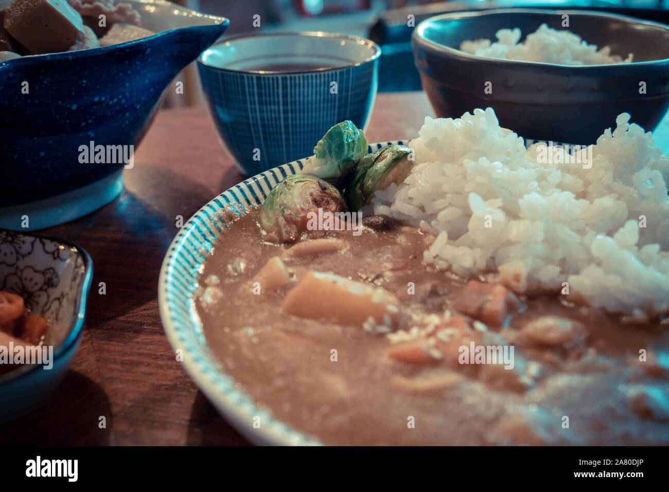 Asian pork curry with other dishes, trendy color grading Stock Photo ...