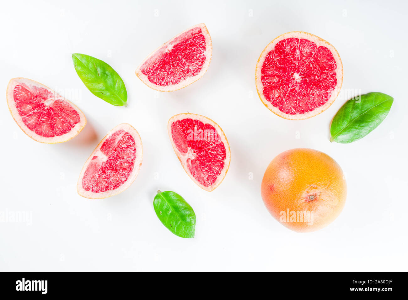 Whole and sliced grapefruit isolated on white background Stock Photo ...