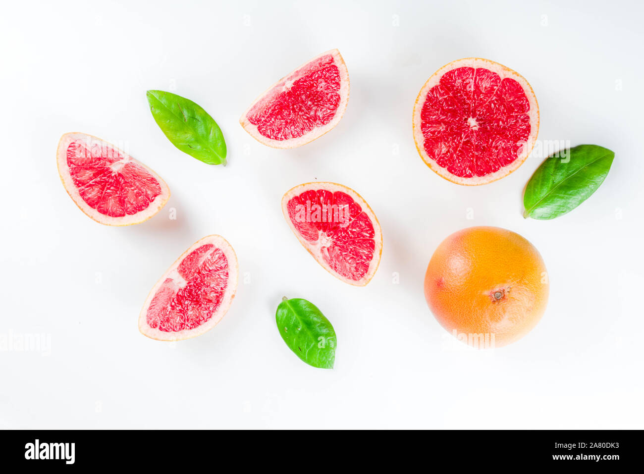 Whole and sliced grapefruit isolated on white background Stock Photo - Alamy