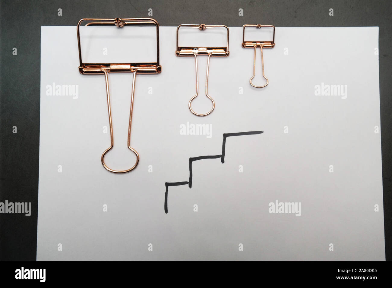 3 Size Of Metal Clips With Hand Drawn Steps Stock Photo - Alamy