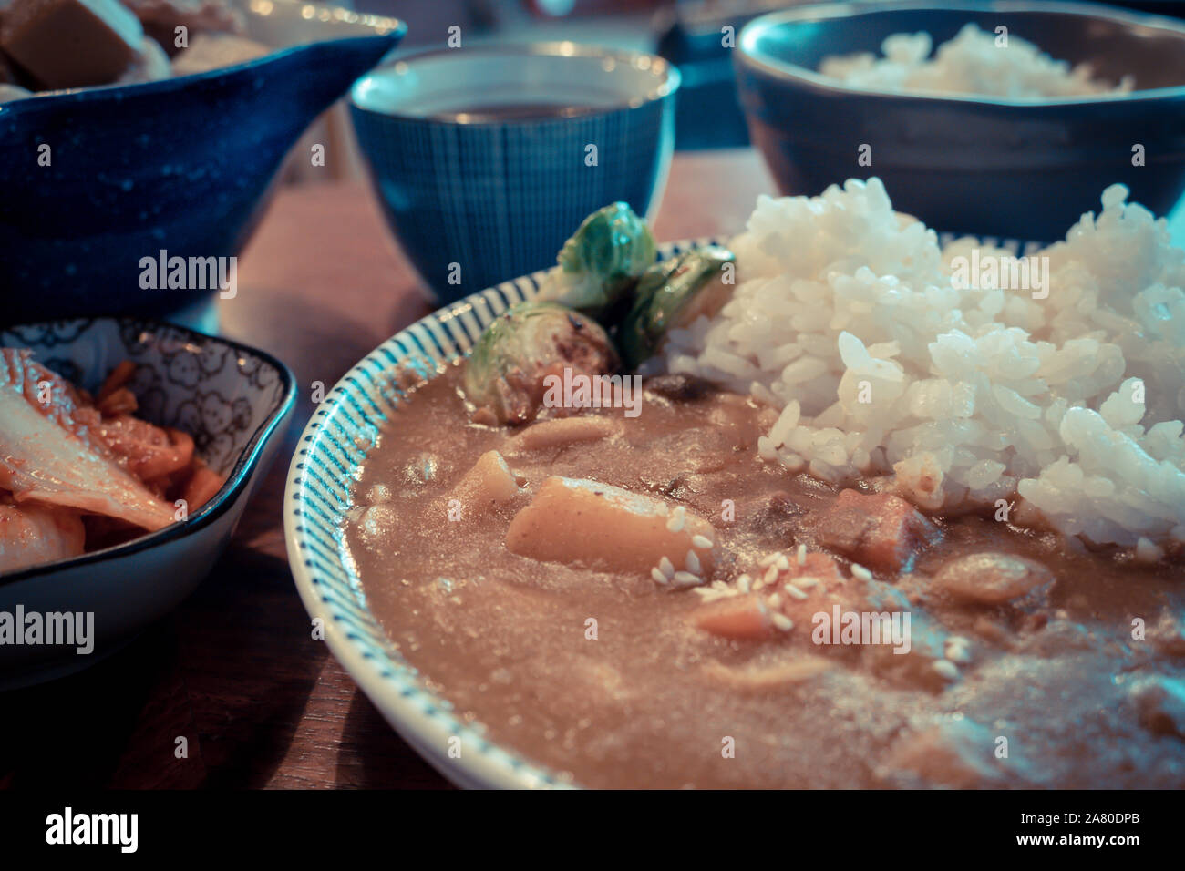 Asian pork curry with other dishes, trendy color grading Stock Photo ...