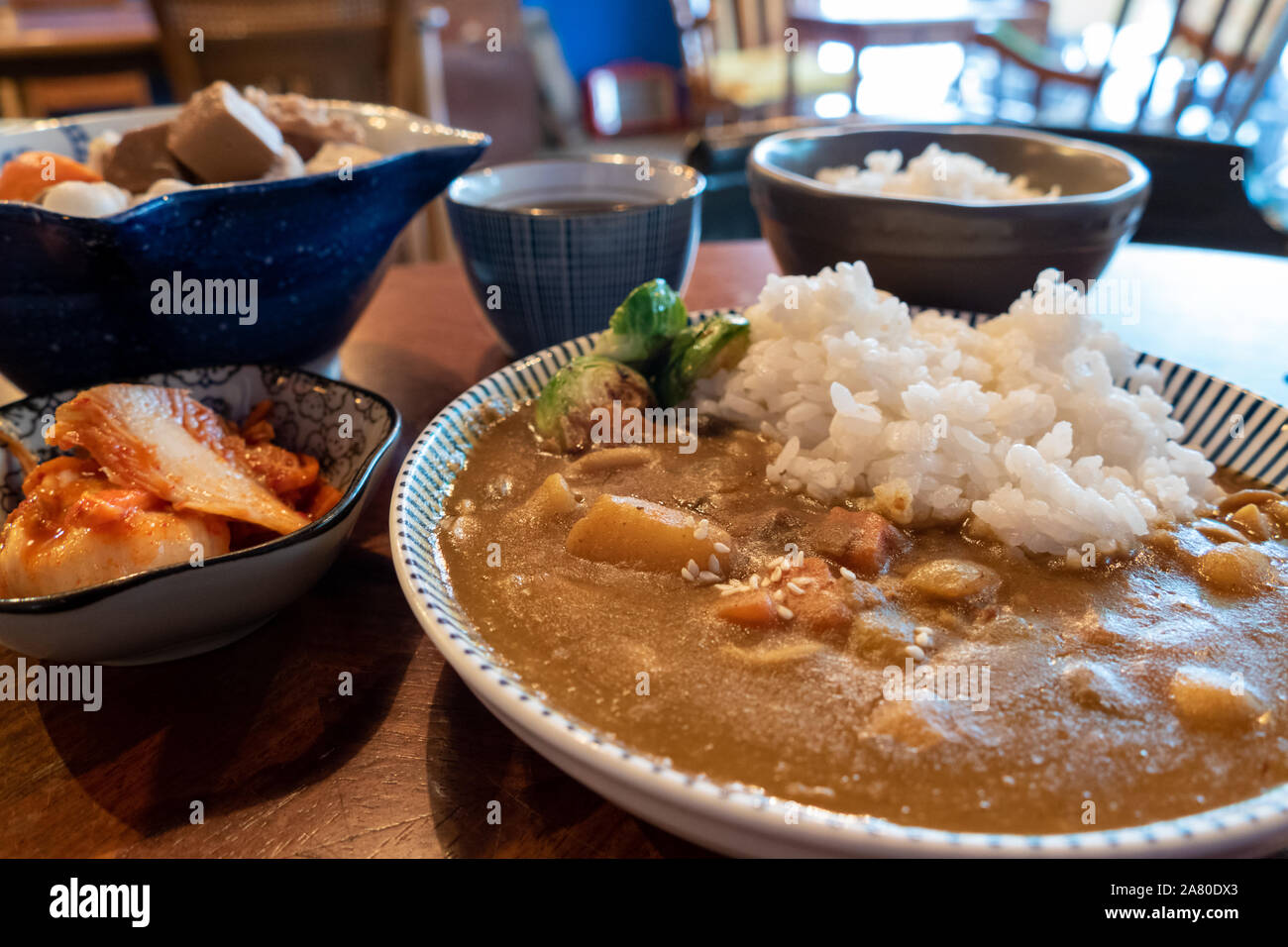 Asian pork curry with other dishes, trendy color grading Stock Photo ...