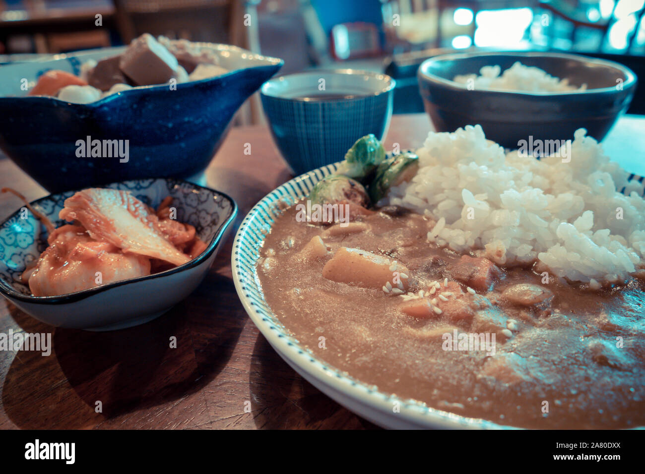 Asian pork curry with other dishes, trendy color grading Stock Photo ...