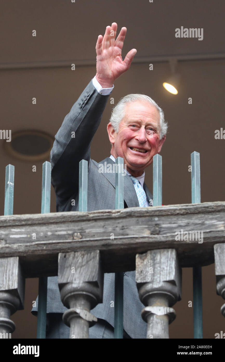 The Prince of Wales greets well-wishers from the balcony of the Market ...