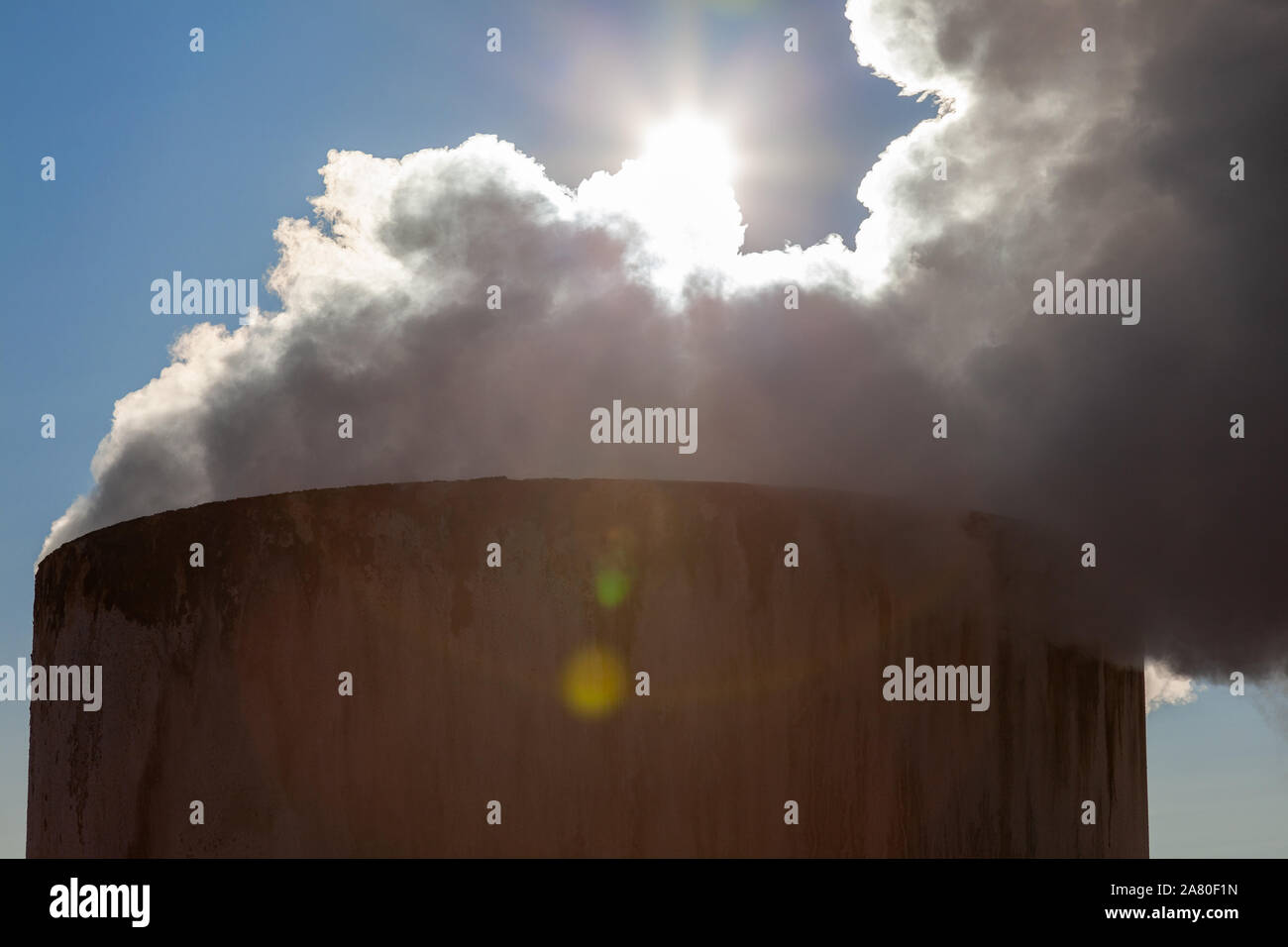 Pollution or smoke coming from the top of a chimney and blocking out ...