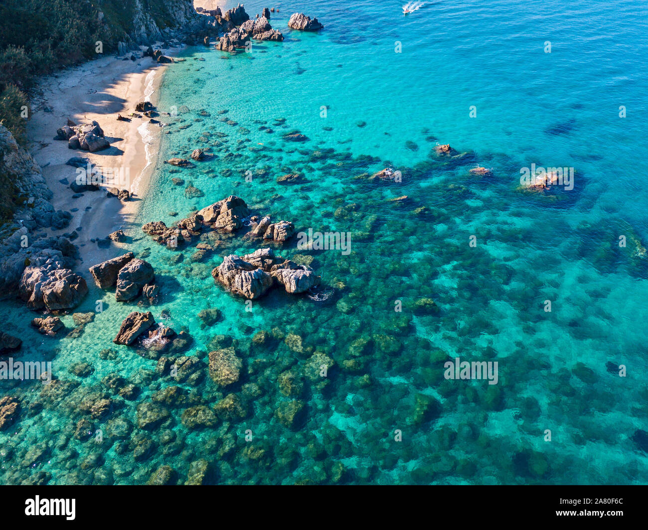 Aerial view of Tropea beach, crystal clear water and rocks on the beach ...