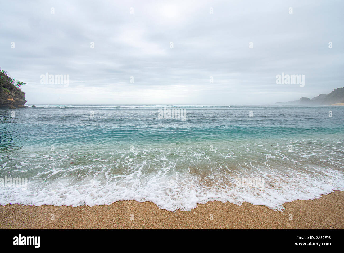 Beautiful beach with brown sand Stock Photo - Alamy
