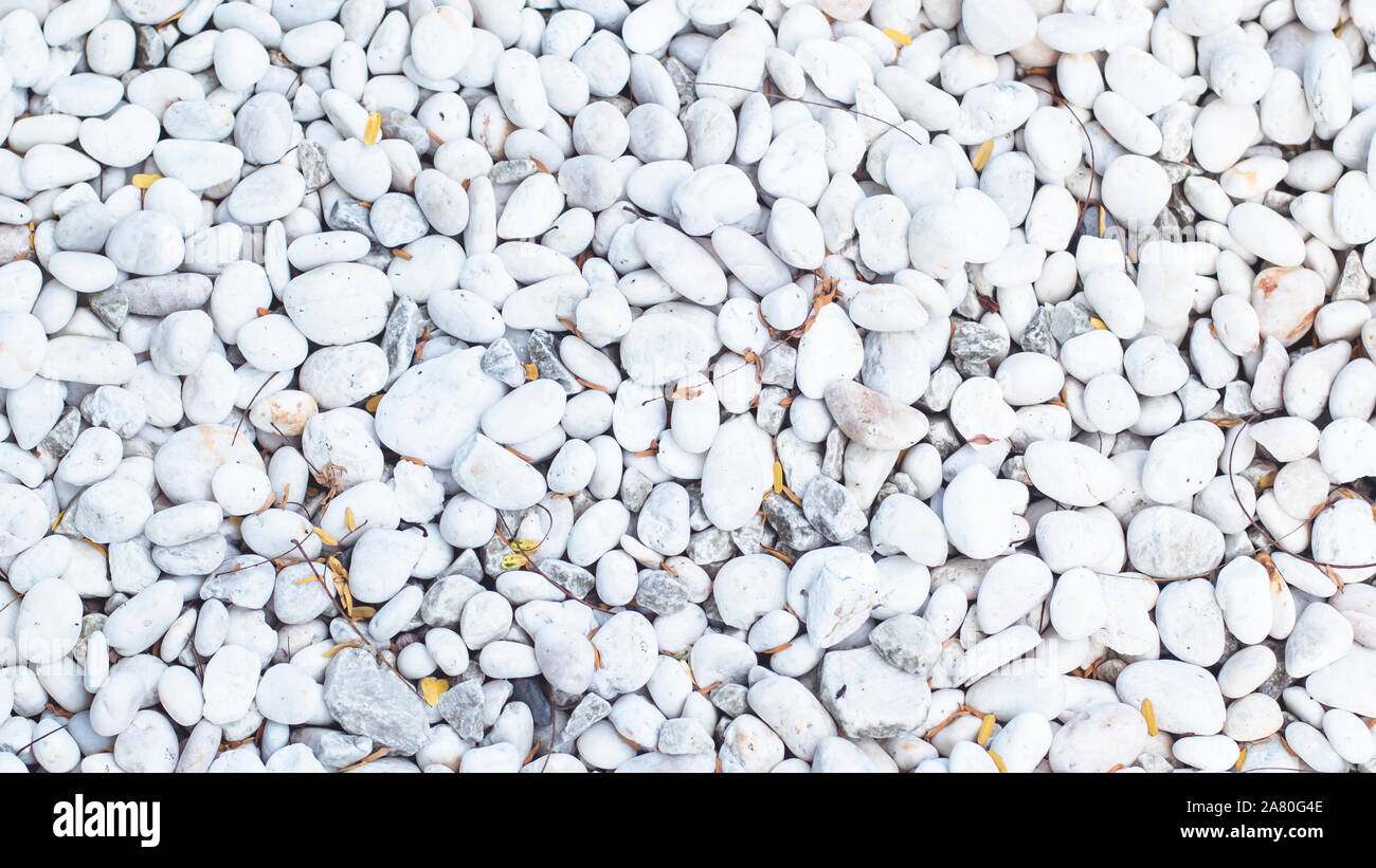 White pebbles stone texture and background Stock Photo - Alamy