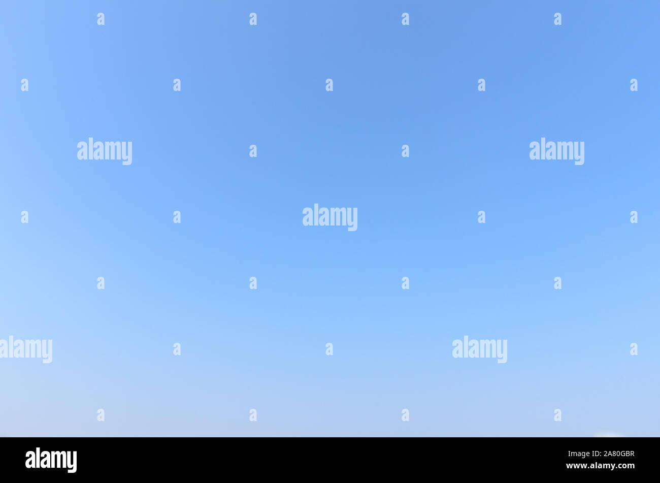 Clear sunny blue sky background showing air pollution or smog at the ...