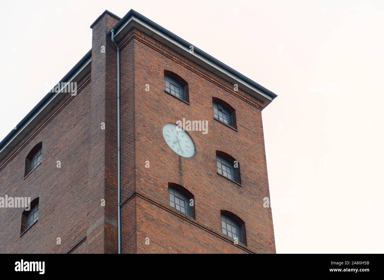 Exterior of a commercial red brick building or industrial factory with ...
