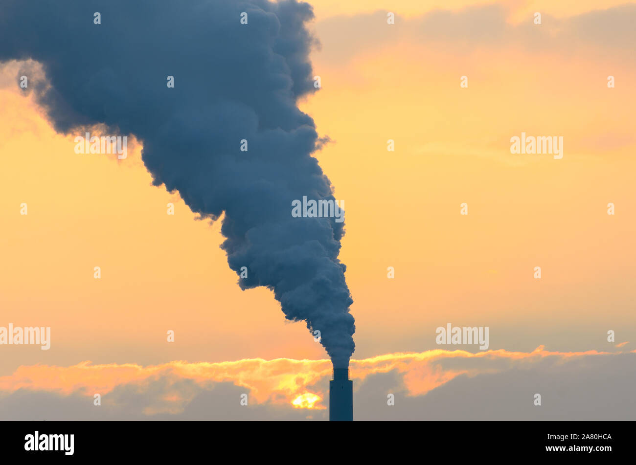 Smoke belching from an industrial smokestack or chimney causing air and ...