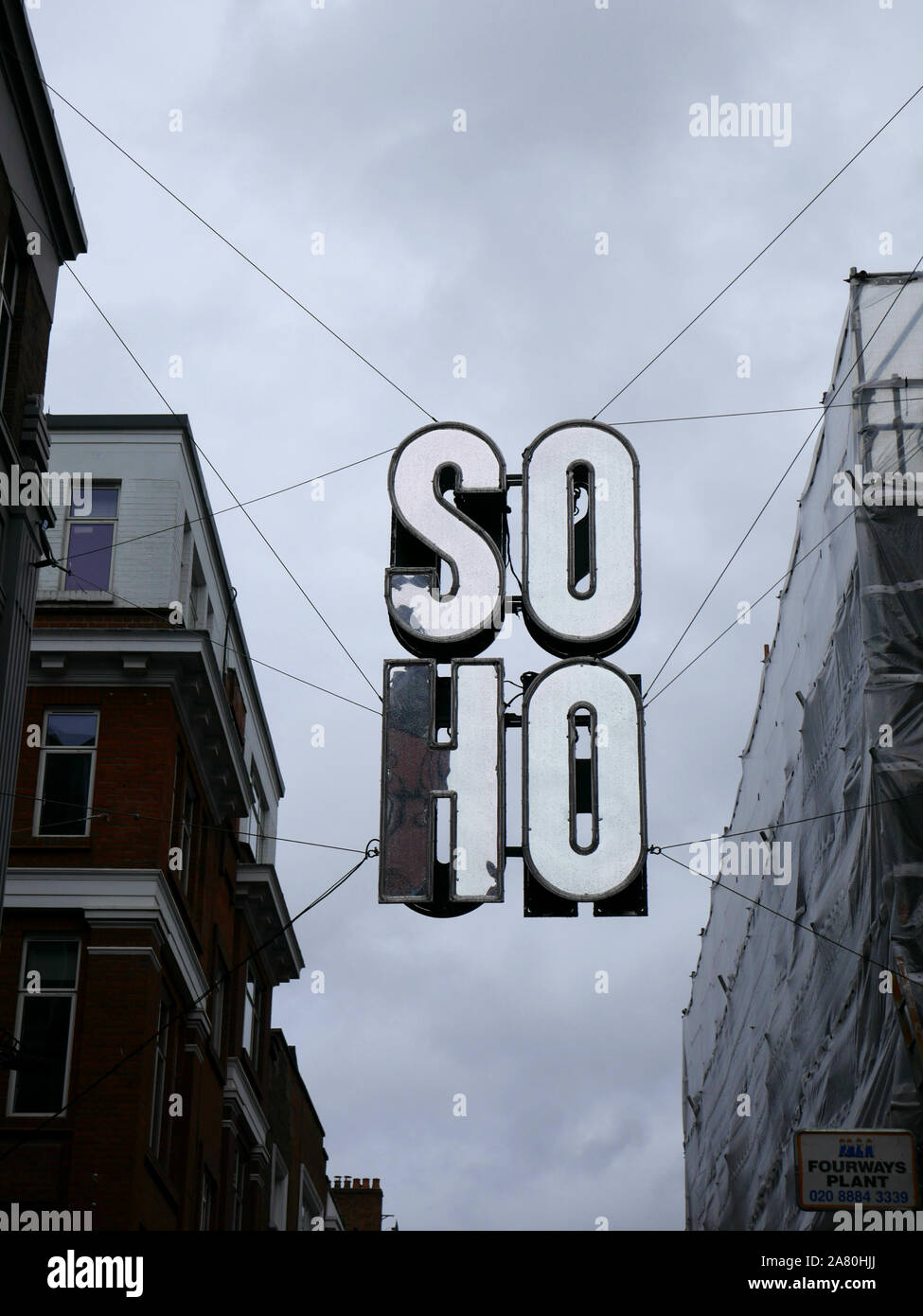 Soho sign suspended above the streets Stock Photo - Alamy