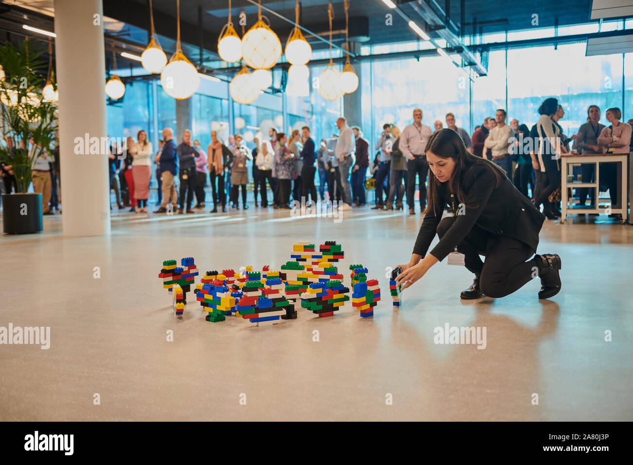 Lego Employee building Lego Challenge Stock Photo - Alamy