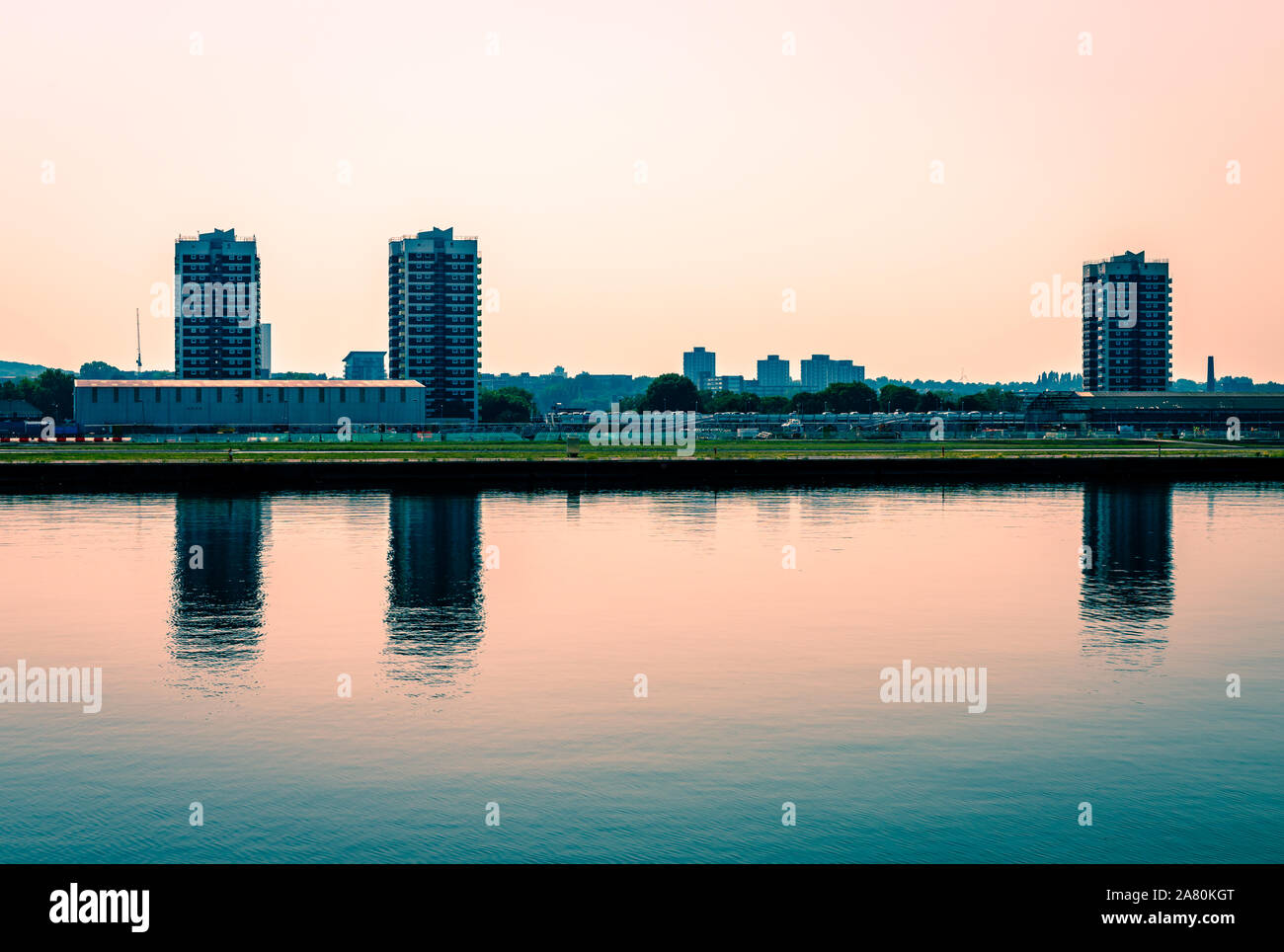 The North Woolwich skyline, with the tower blocks reflected on Thames ...