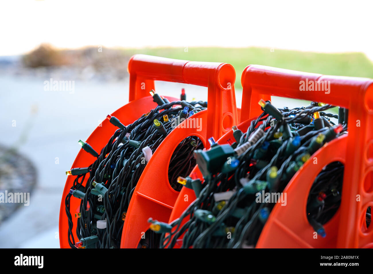 stringed Christmas lights in storage on spool Stock Photo - Alamy