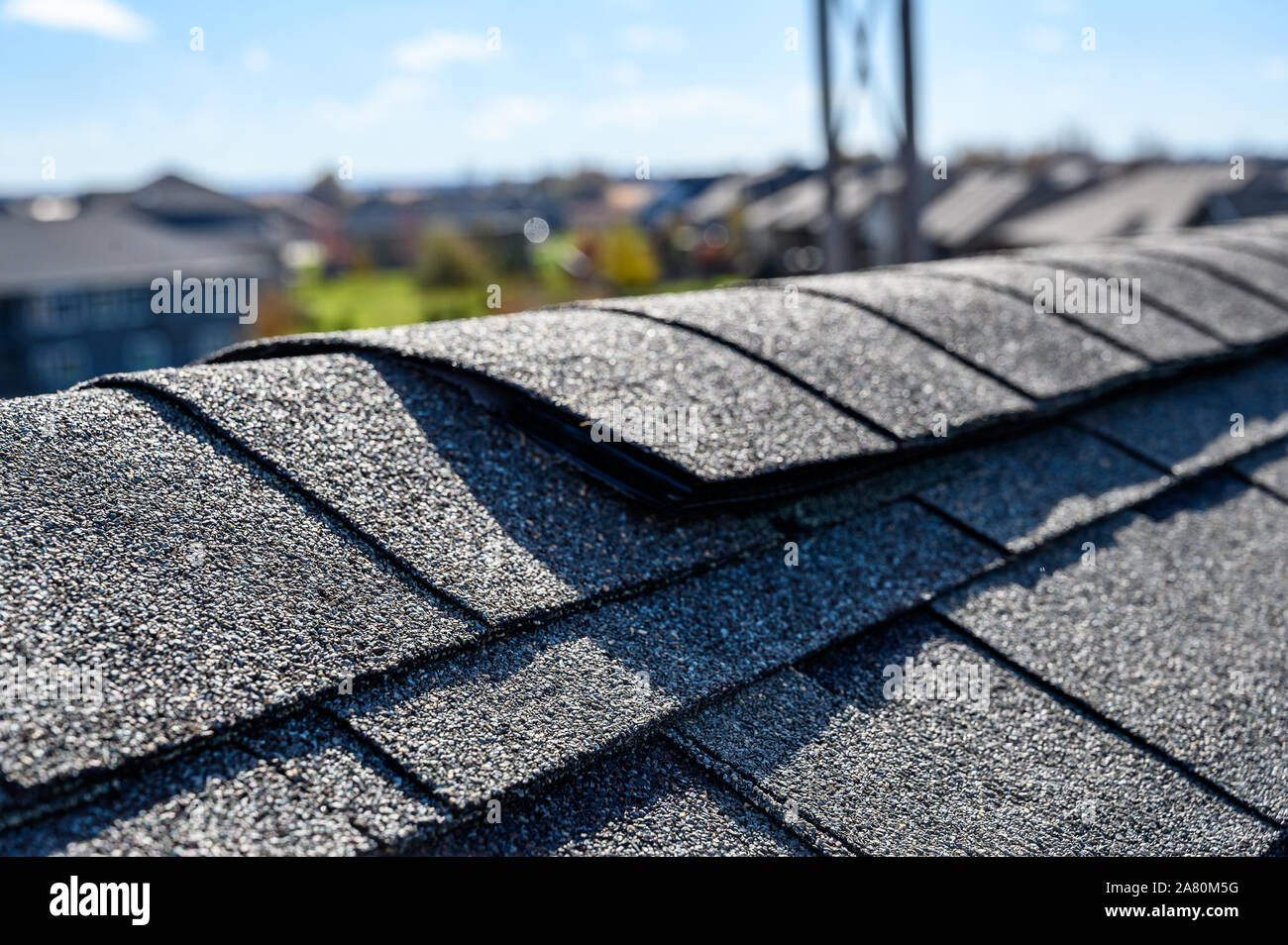 Asphalt shingle room with ridge cap Stock Photo - Alamy