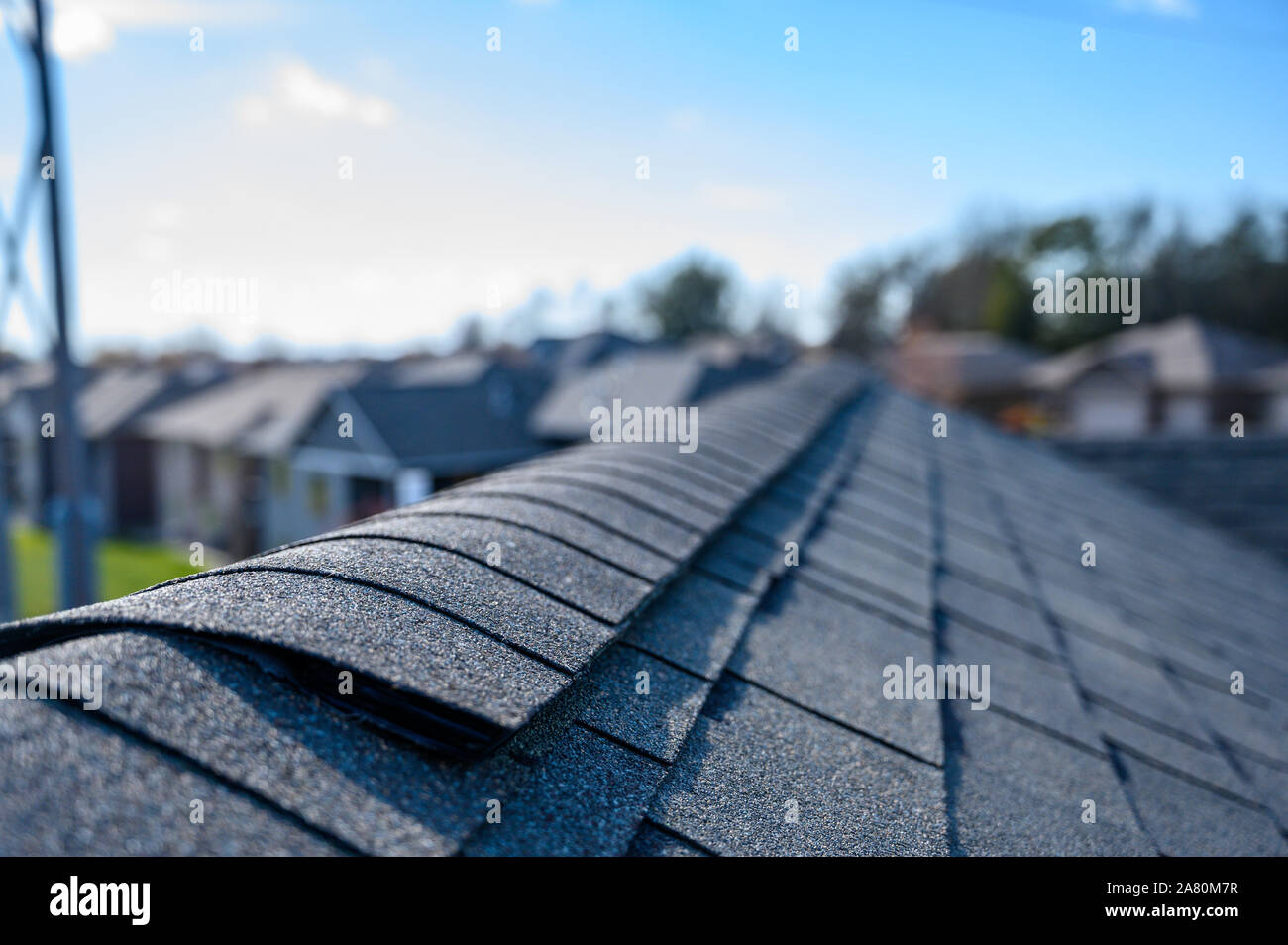Asphalt shingle room with ridge cap Stock Photo - Alamy