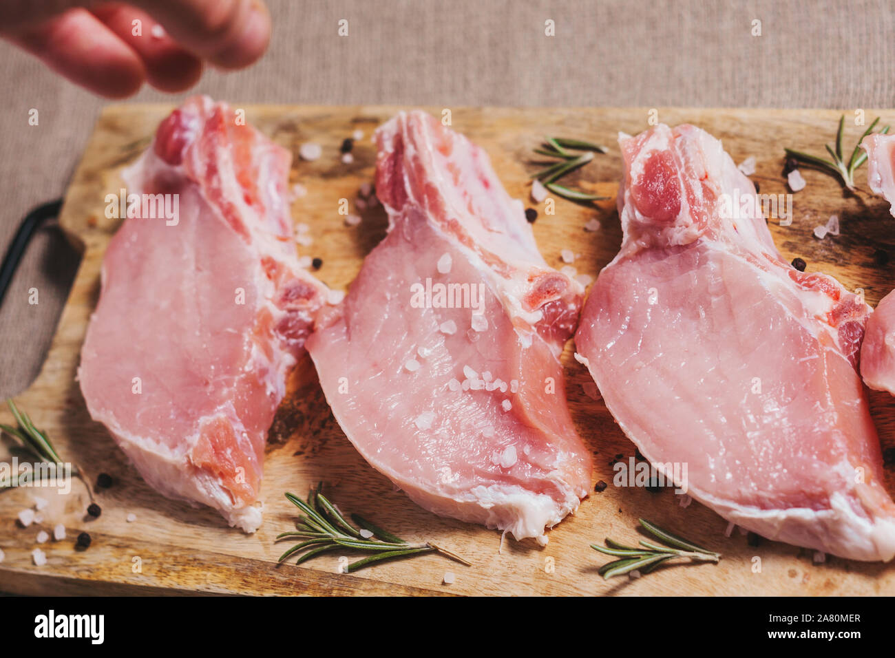 The cook salt pork loin before frying Stock Photo - Alamy