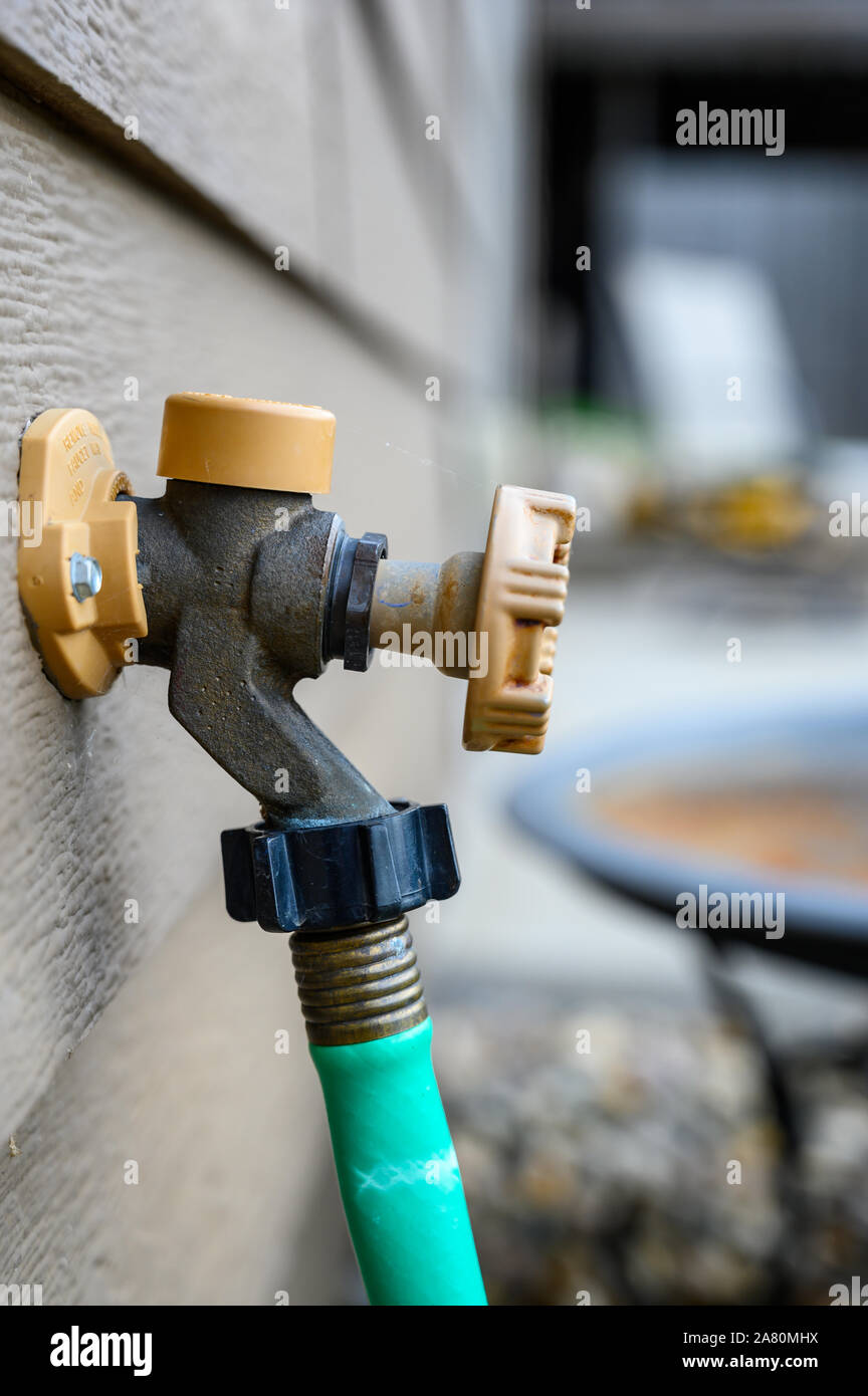 Handle-Operated Freezeless Residential Wall Hydrant mounted on exterior ...