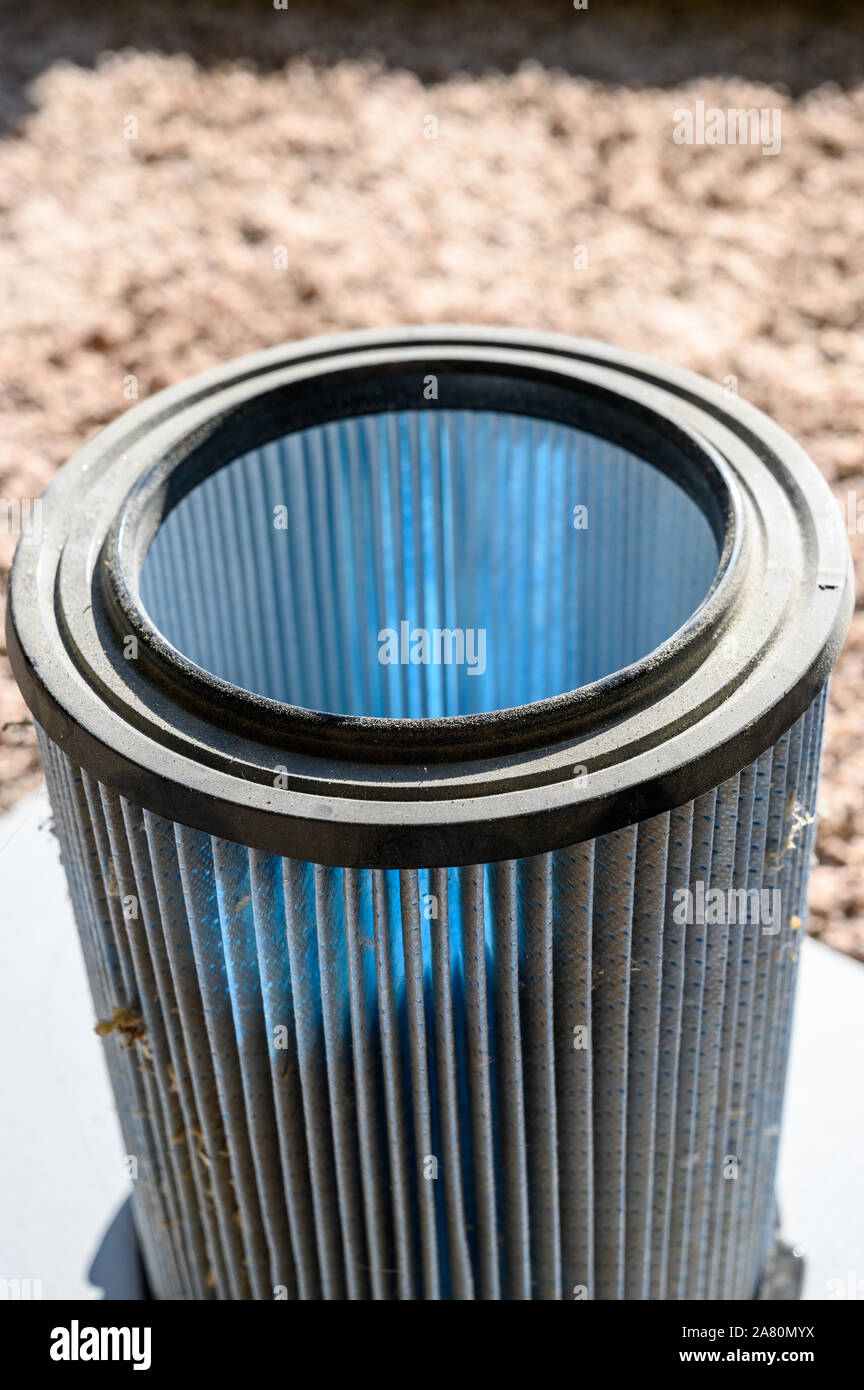Shop vacuum cartridge air filter with wood chips captured Stock Photo ...
