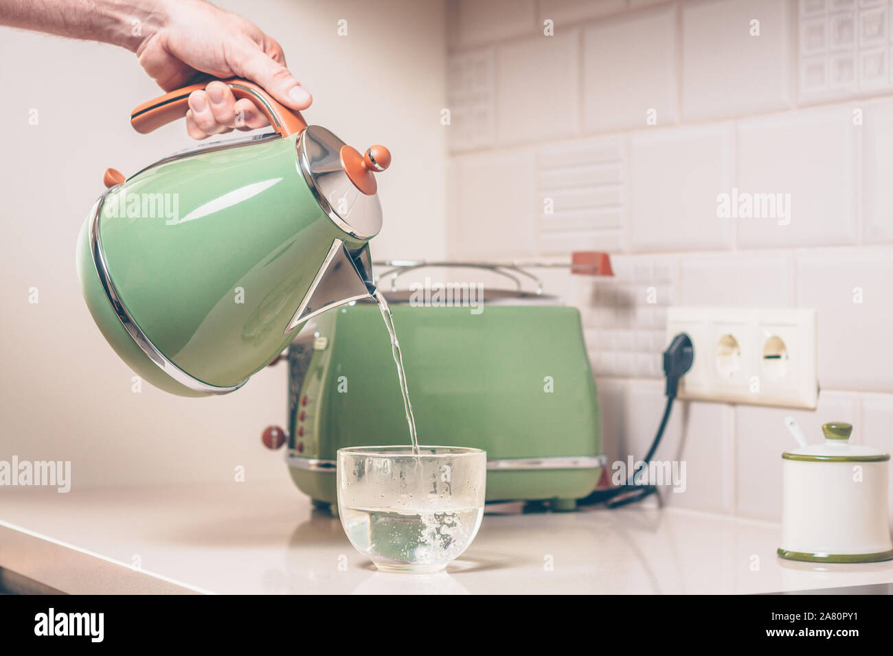 Woman kettle pour water cup hi-res stock photography and images - Alamy