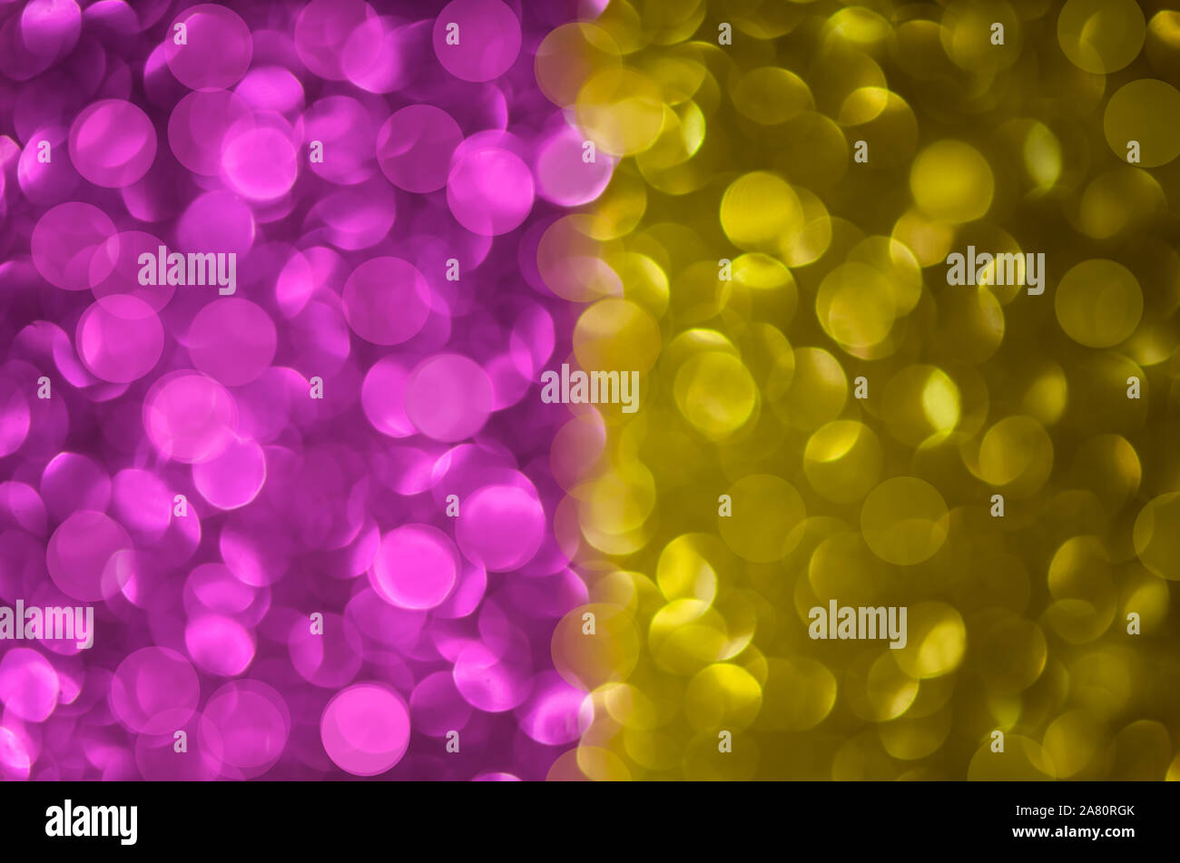 Abstract glitter two color lights background. de-focused. pink, gold ...