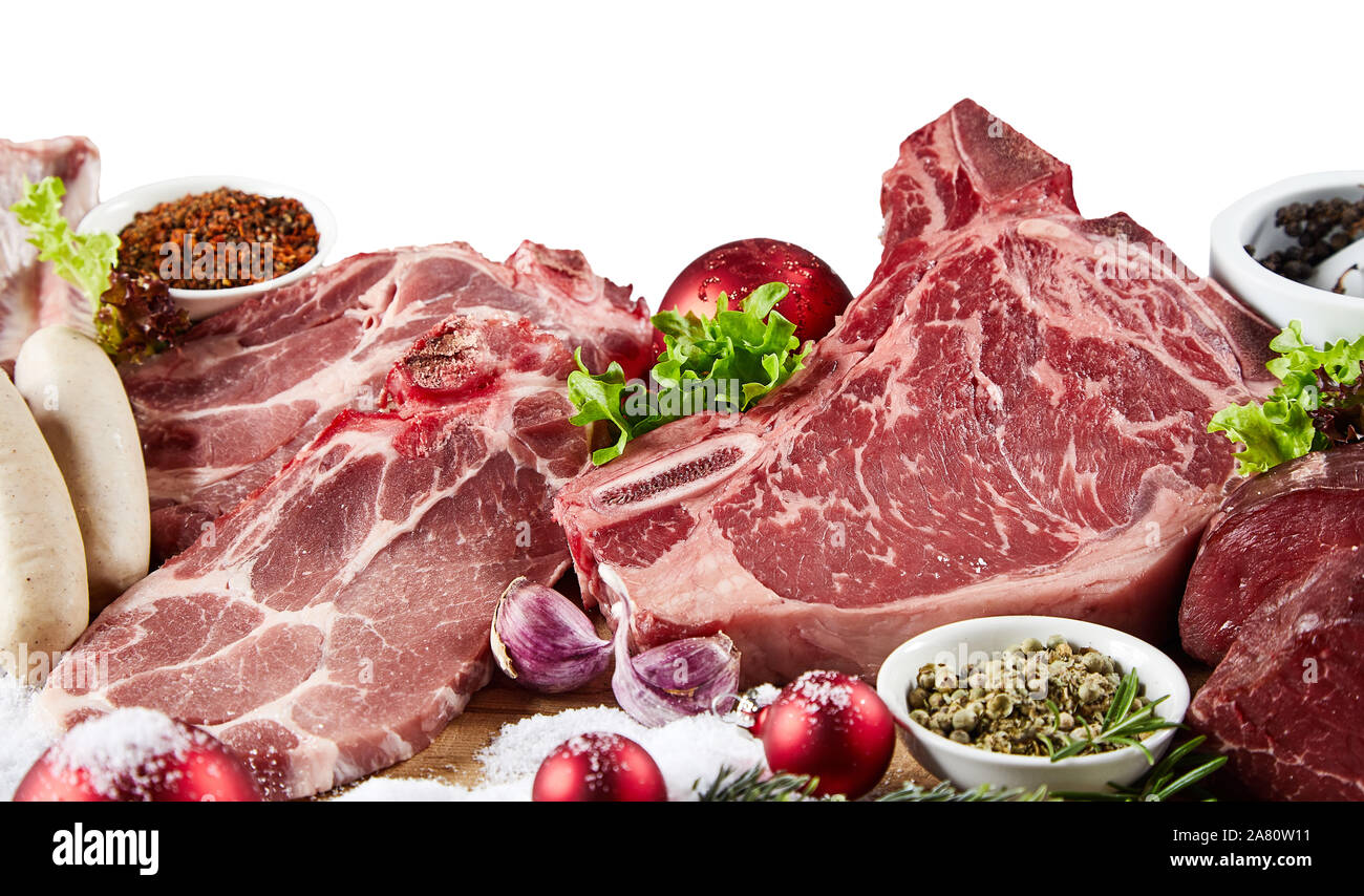 Raw red meat and ingredients for winter holiday cooking theme, layout ...