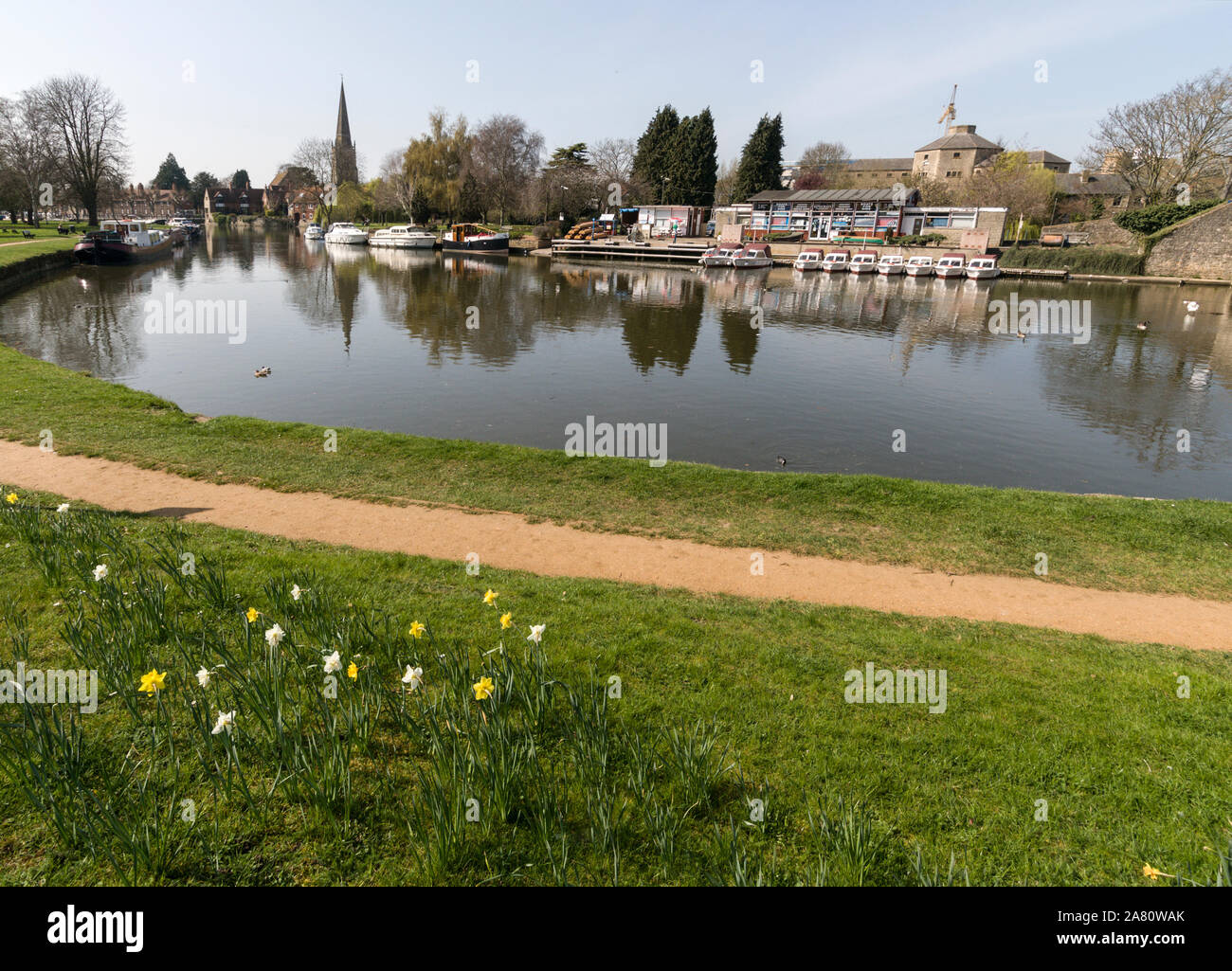 Spring sunshine over the River Thames and St. Helen's Church that ...