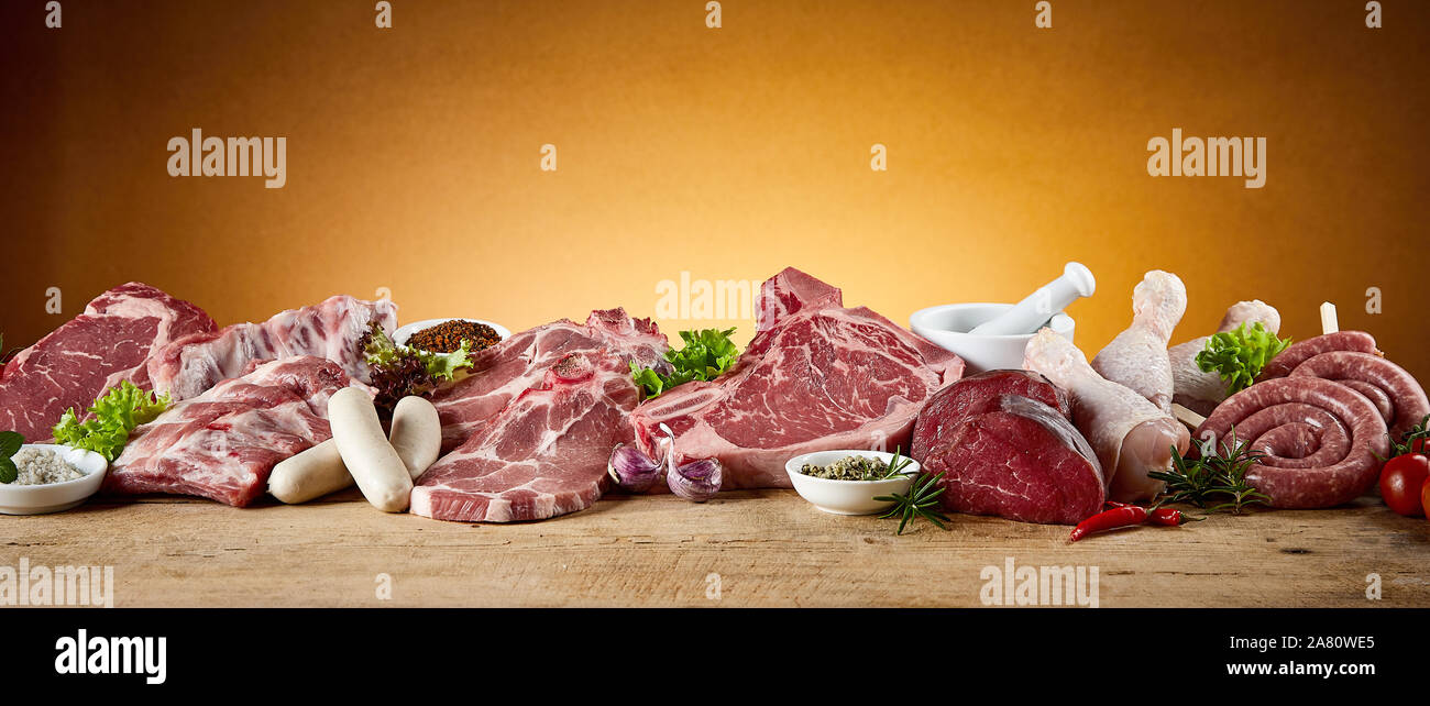 Panorama banner with large assortment of raw meat for a BBQ with beef ...