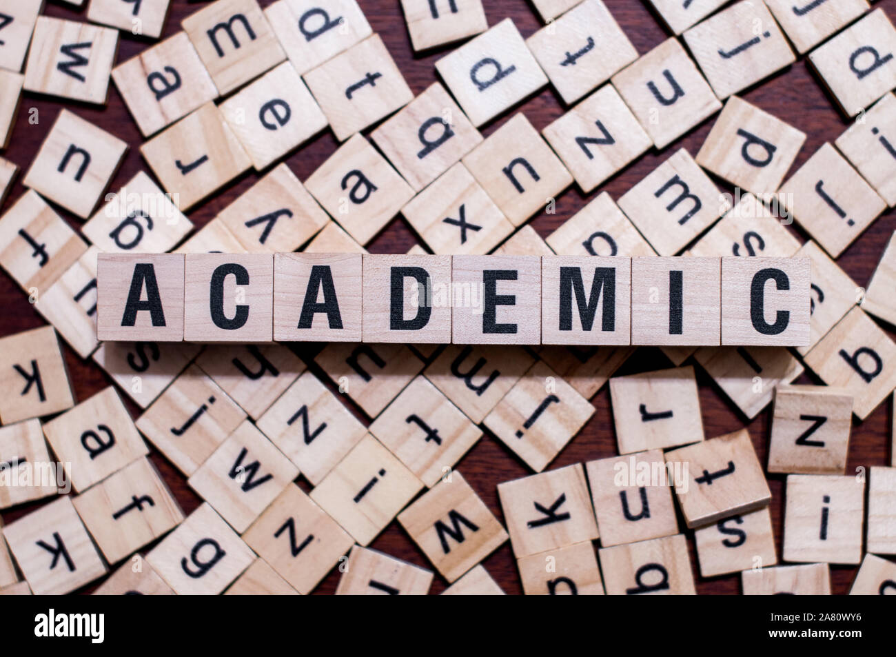 Academic word concept on cubes for articles Stock Photo - Alamy