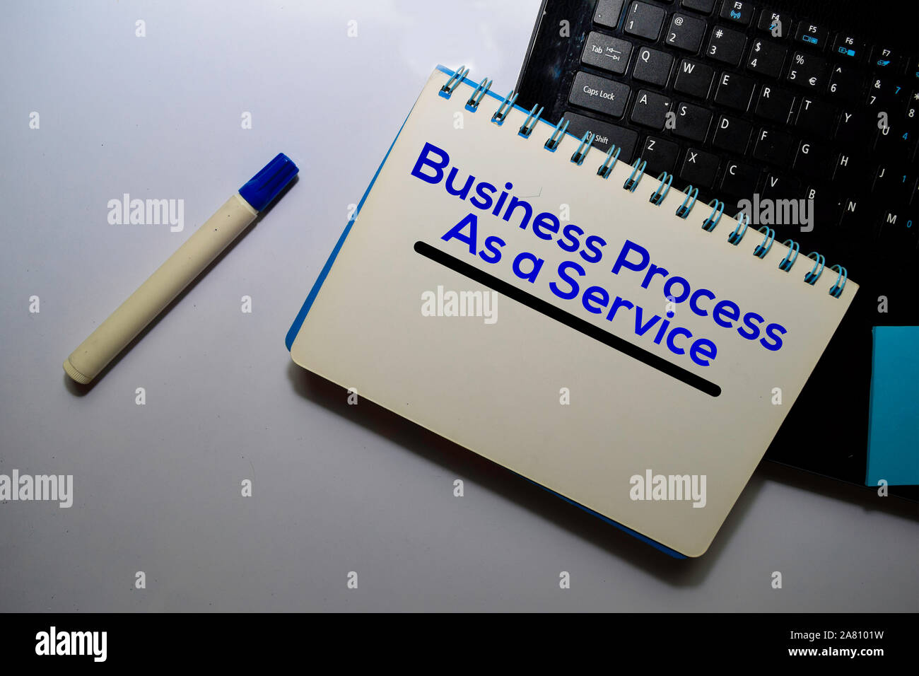 Business Process As A Service write on book with laptop keyboard ...