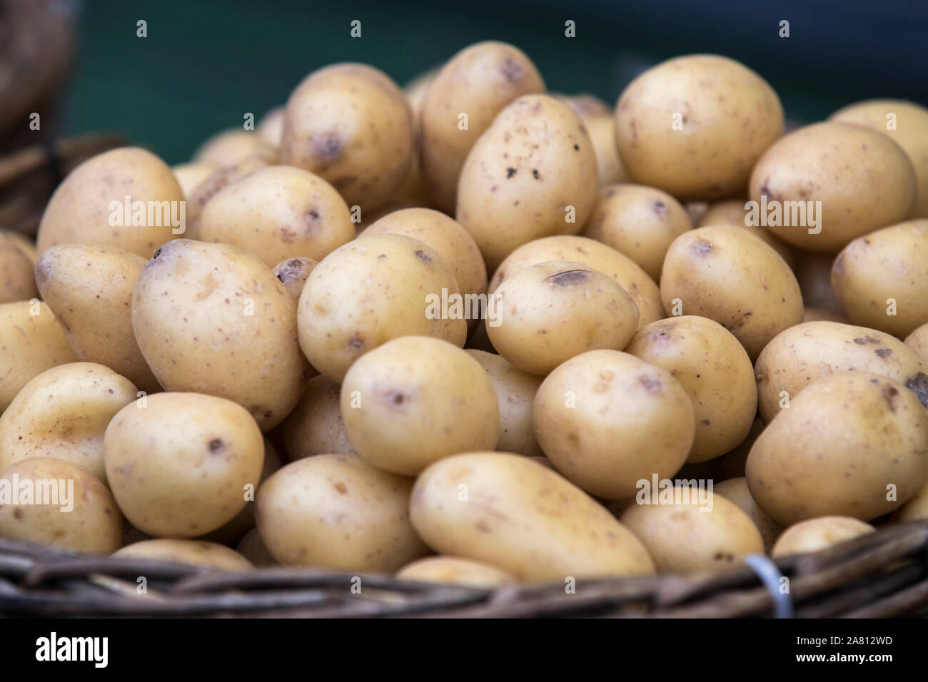 Raw potatoes in baskets on the market close up shot Stock Photo - Alamy