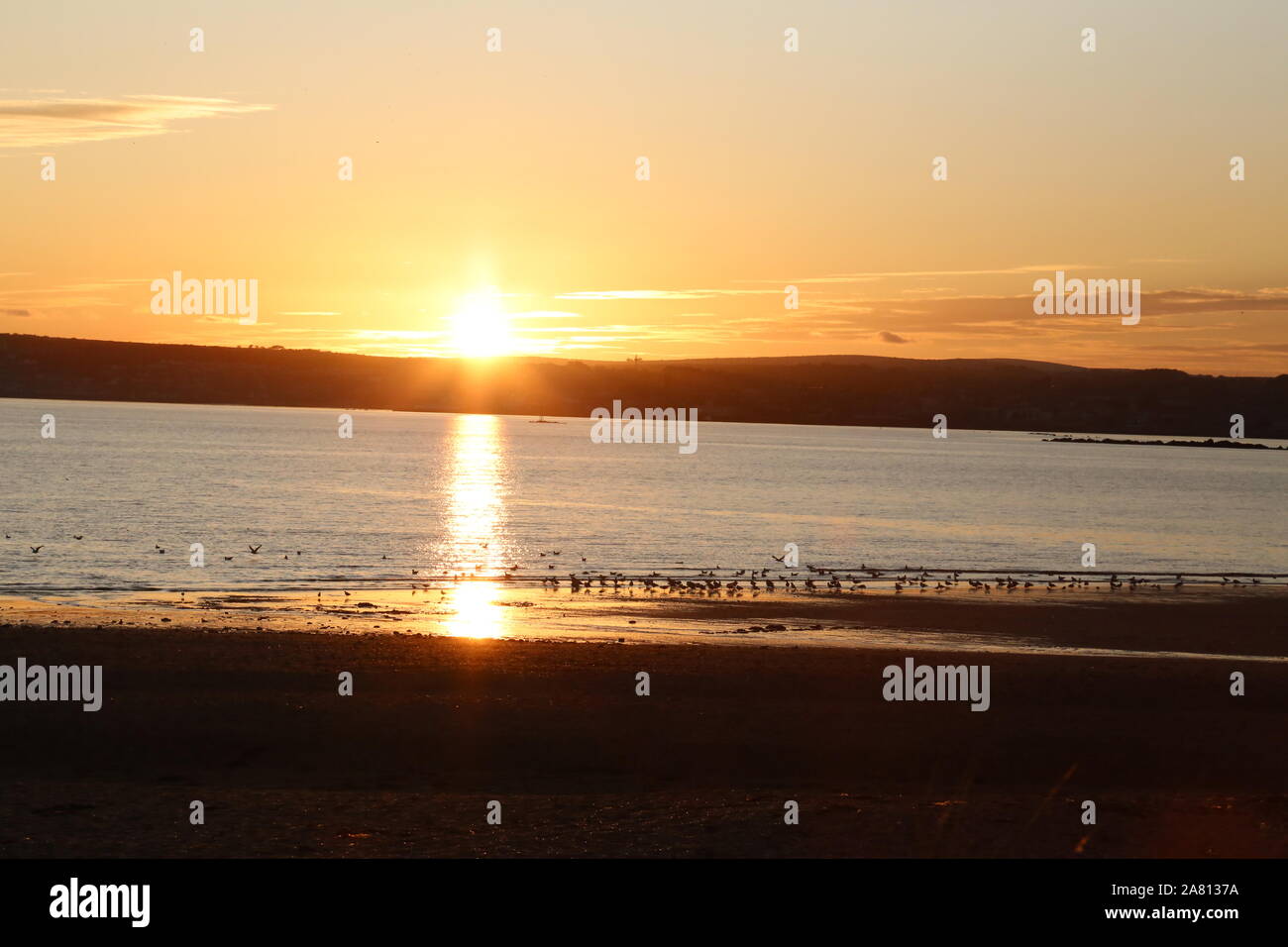 Sun setting over sea hi-res stock photography and images - Alamy