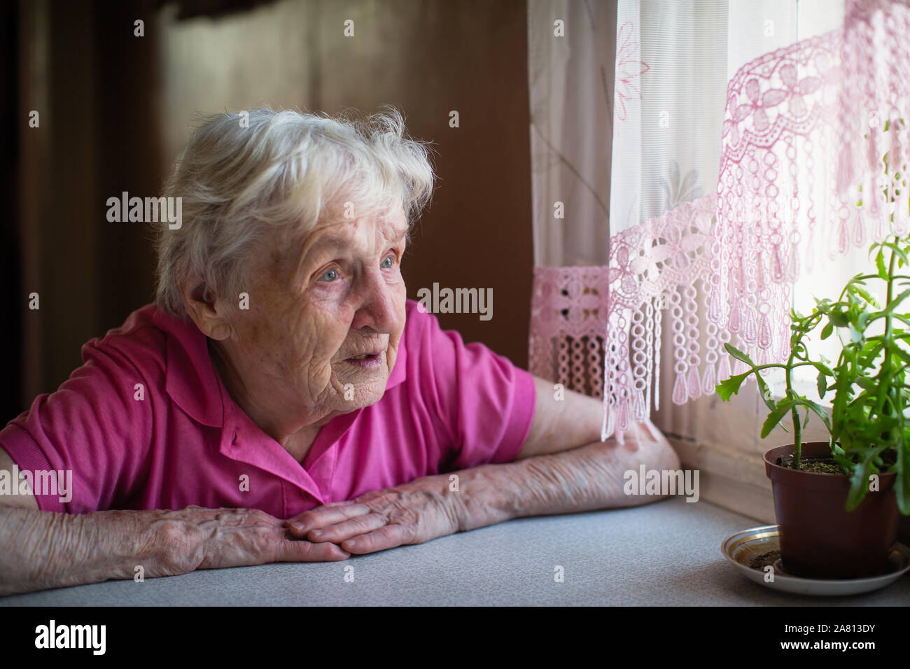Grandma looking out window hi-res stock photography and images - Alamy