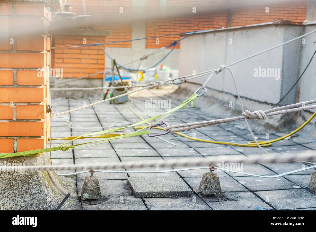 Industrial climbing work site. Rope access working and equipment on top ...