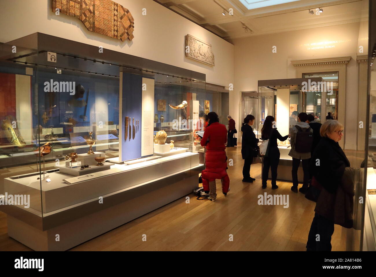 Visitors studying exhibits at the British Museum, London, UK Stock ...