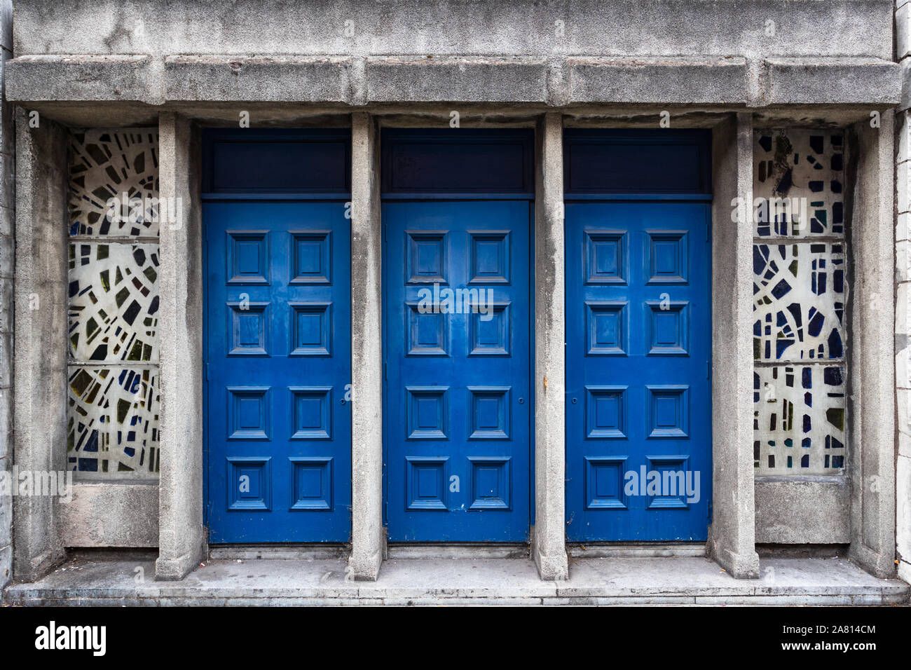 Three Blue doors on old concrete church building in Cork city, Ireland ...
