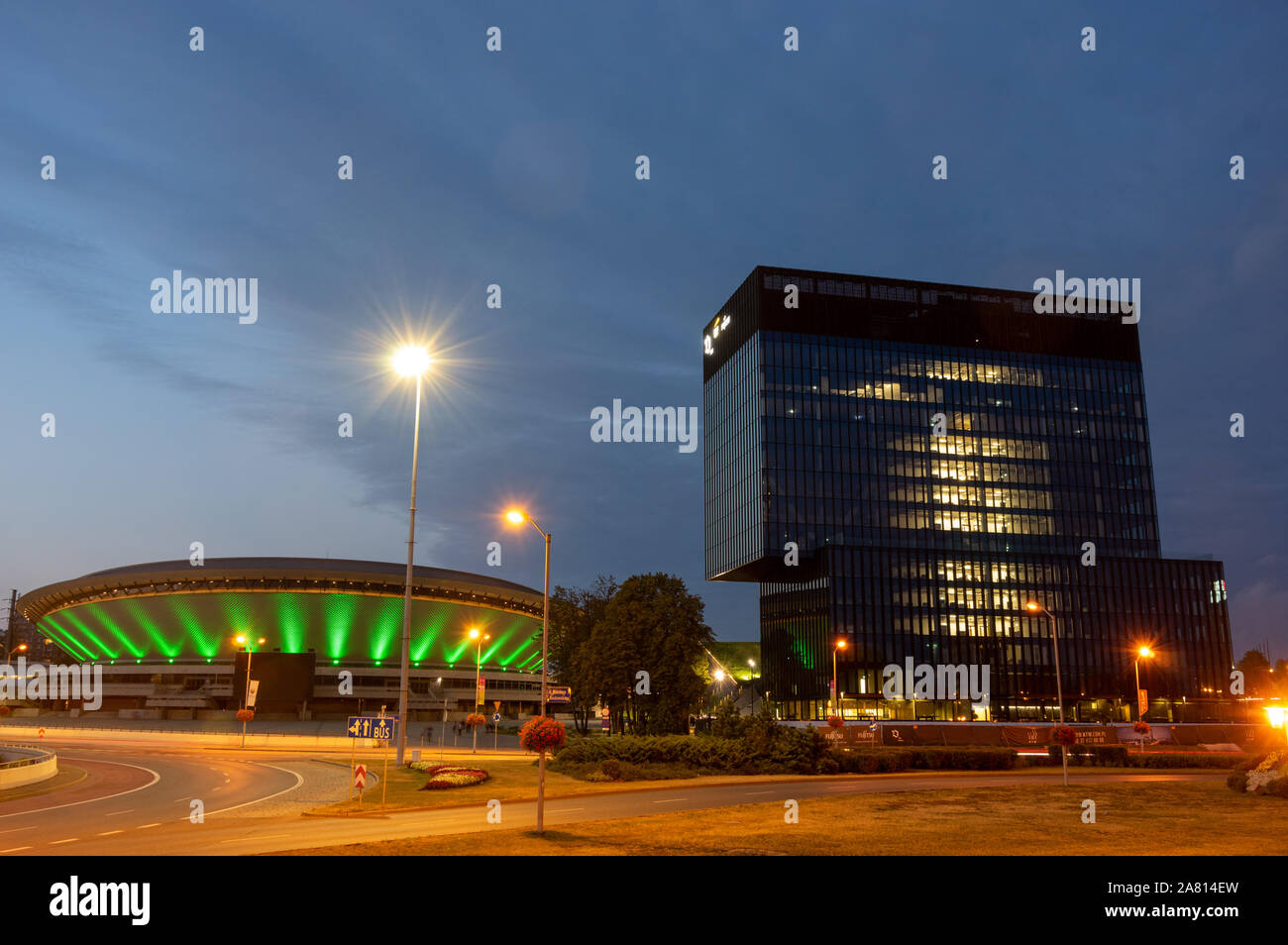 .KTW building and Spodek green lighted arena on evening Stock Photo - Alamy