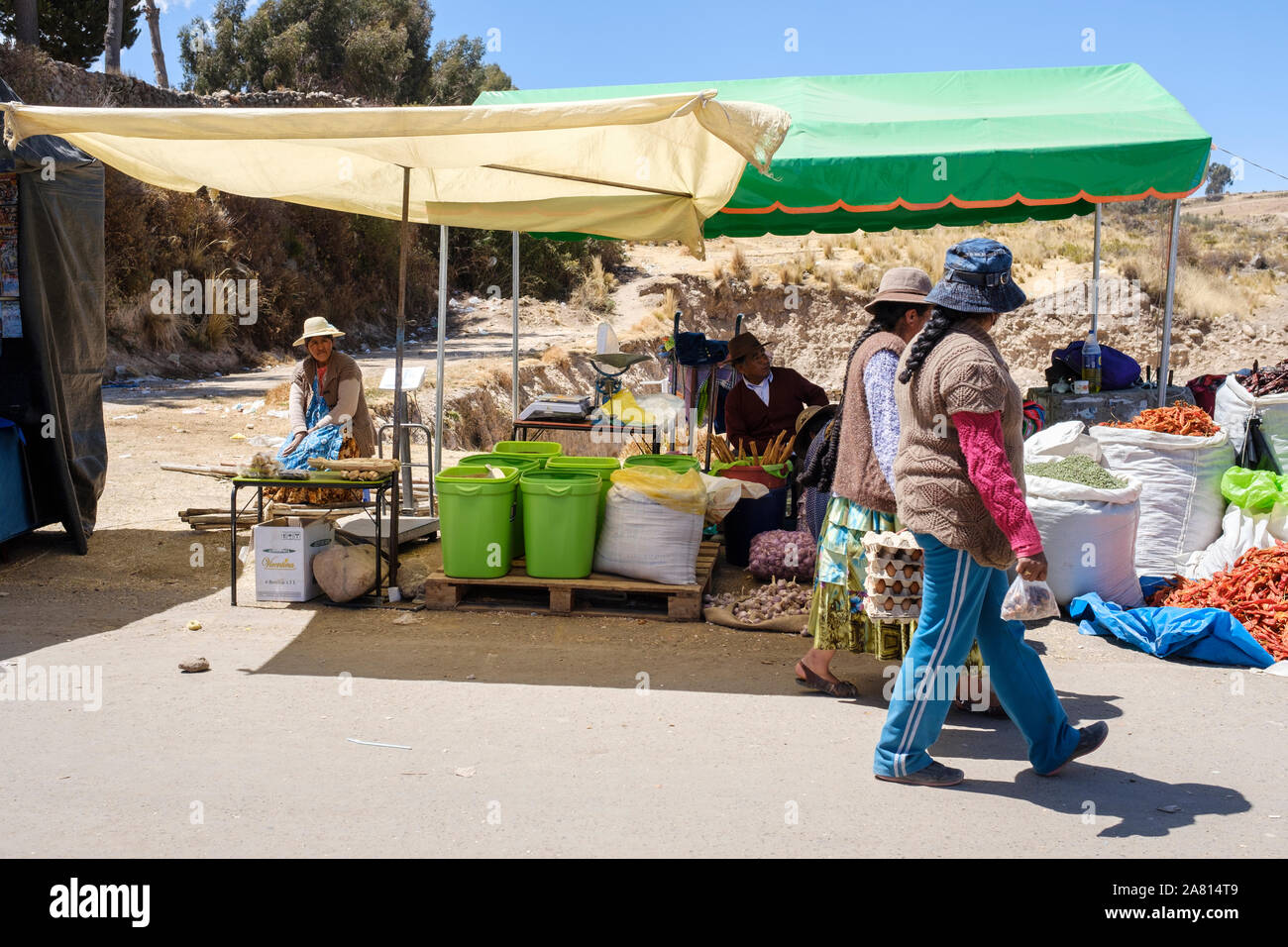 People walking on street market in the Peru side of the Peru-Bolivia ...