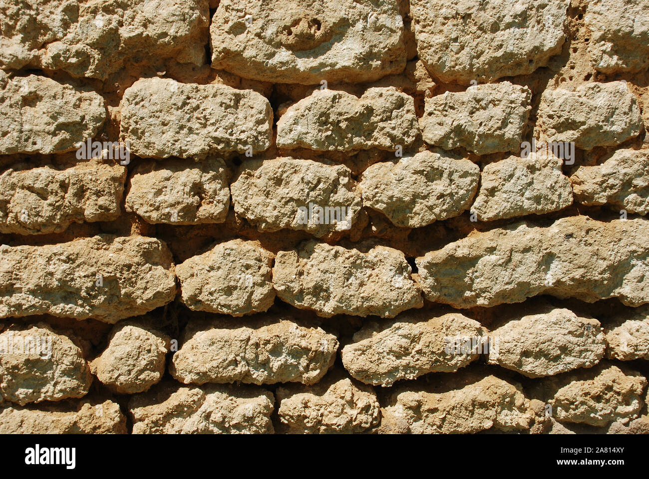 Solid wall made of stone Stock Photo - Alamy
